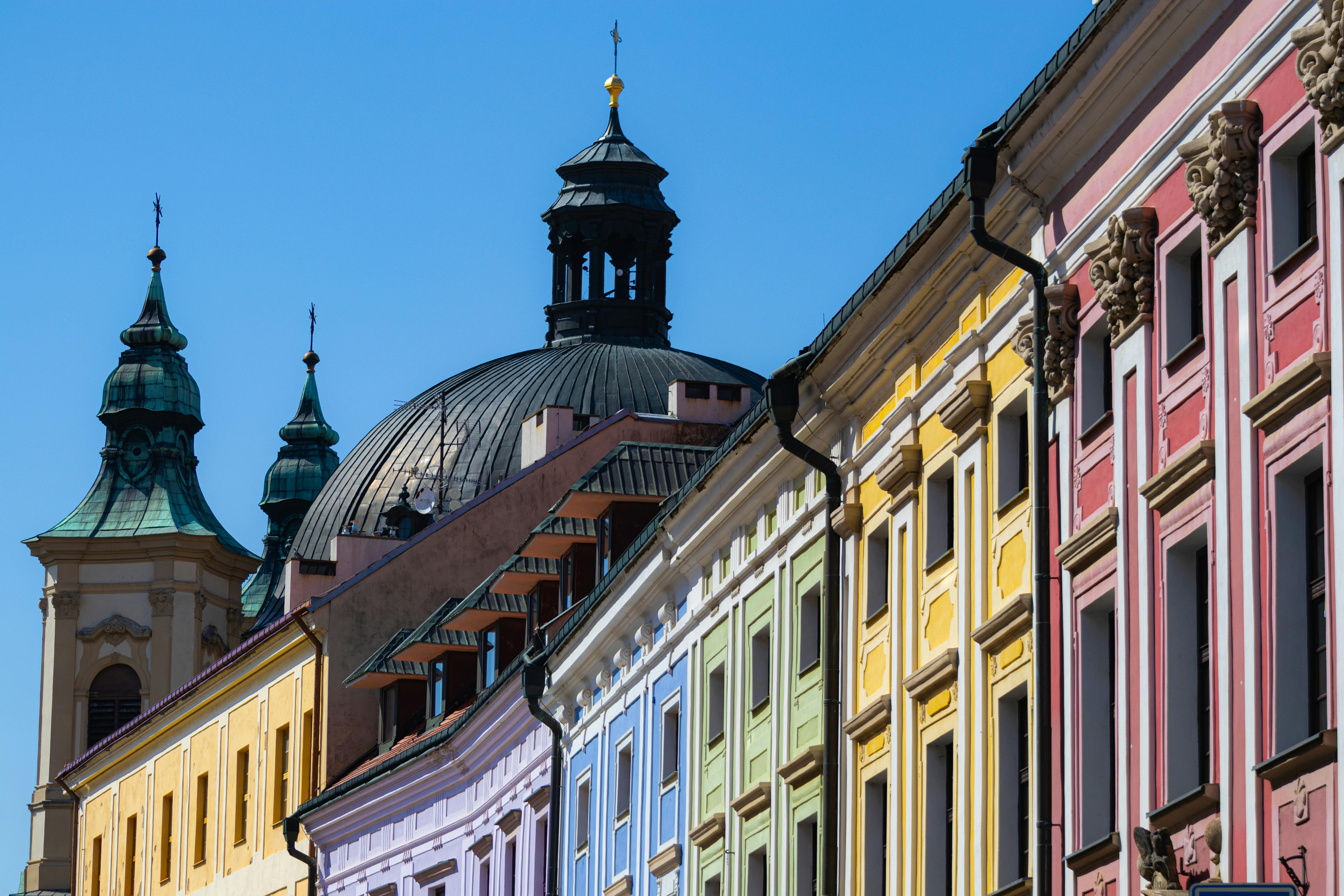 Colorful Buildings and Church Towers in City · Free Stock Photo