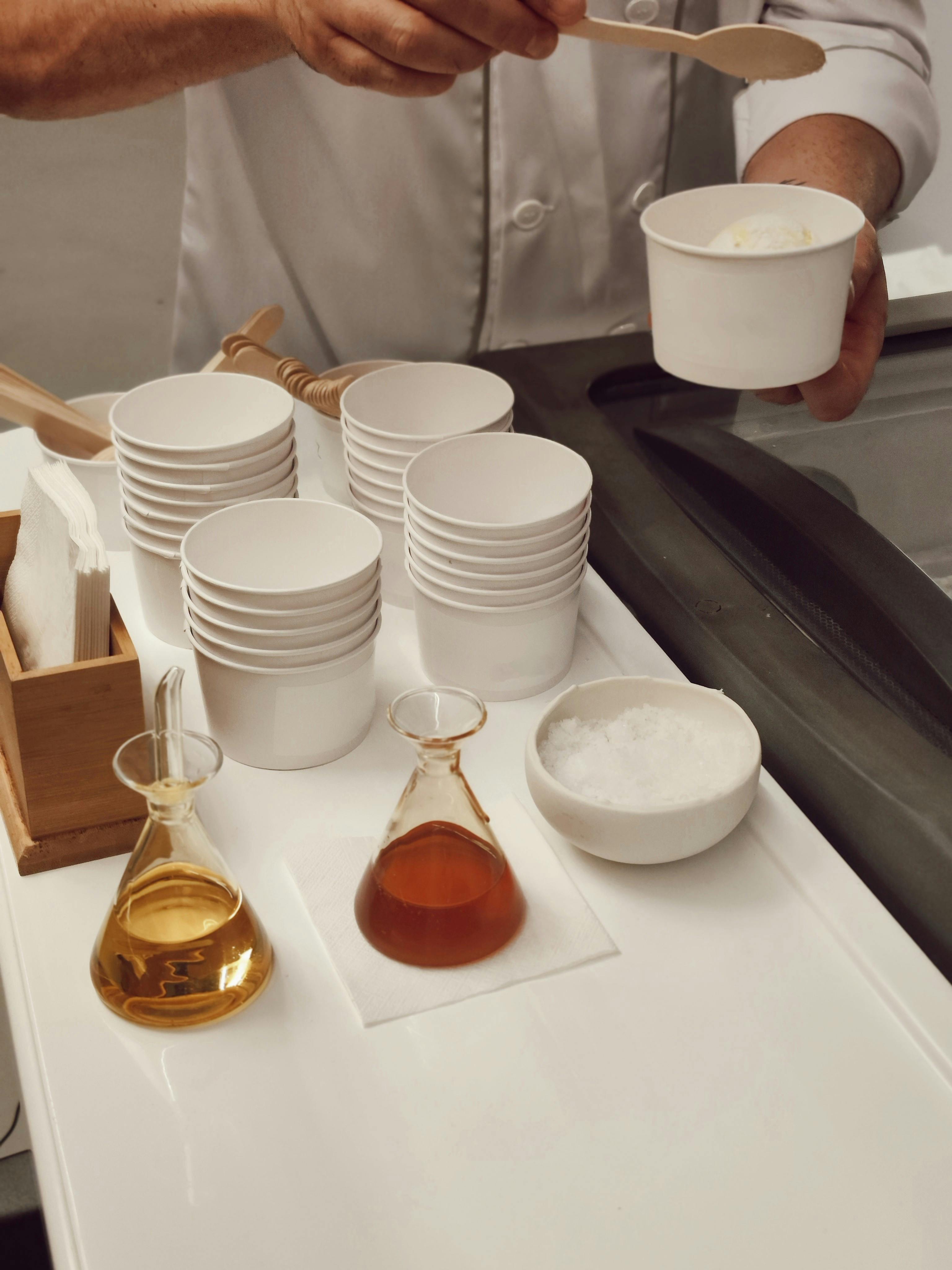 Bowls and Vials on Table in Kitchen · Free Stock Photo