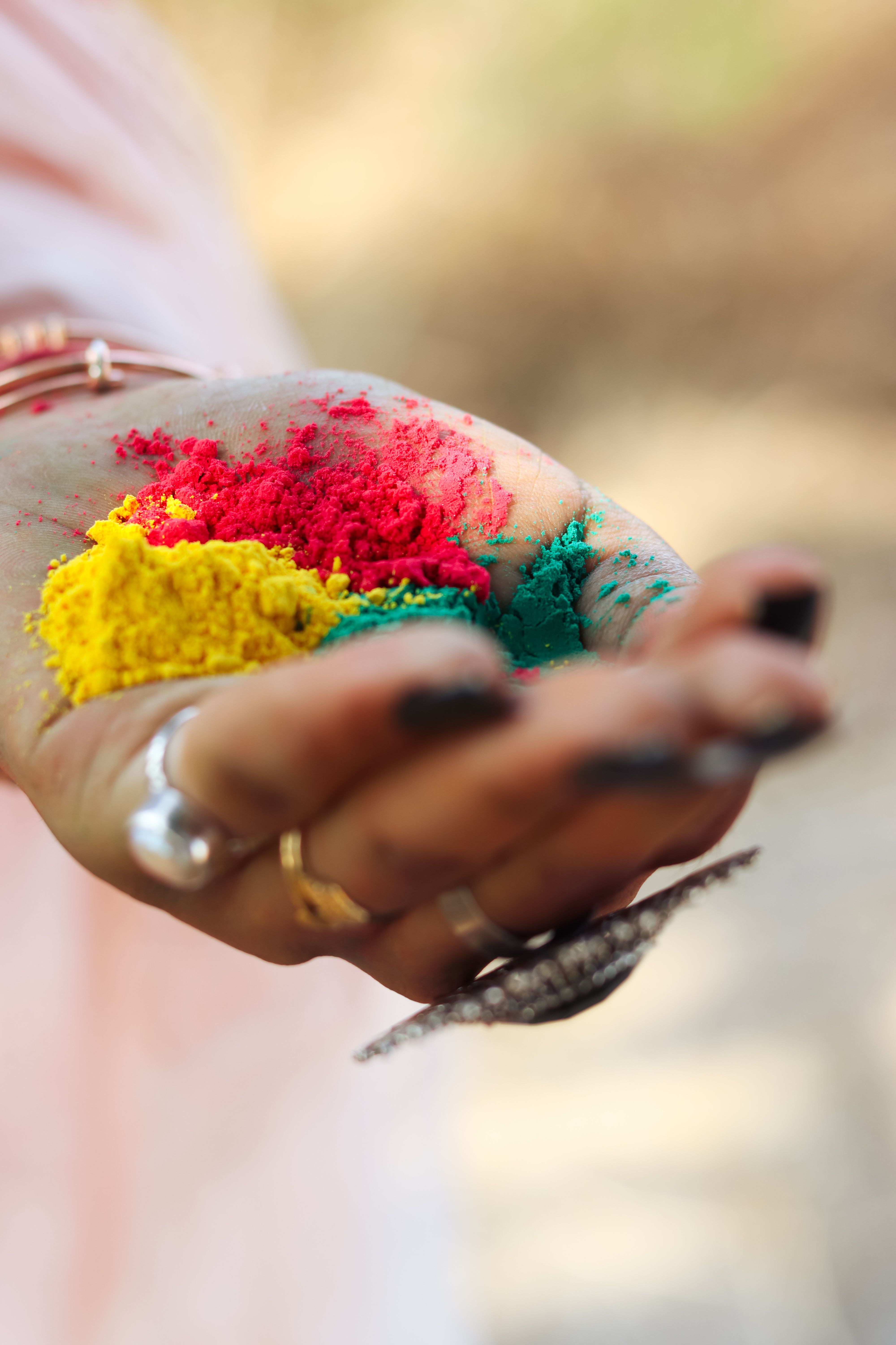 Woman Hand Holding Colorful Powder · Free Stock Photo