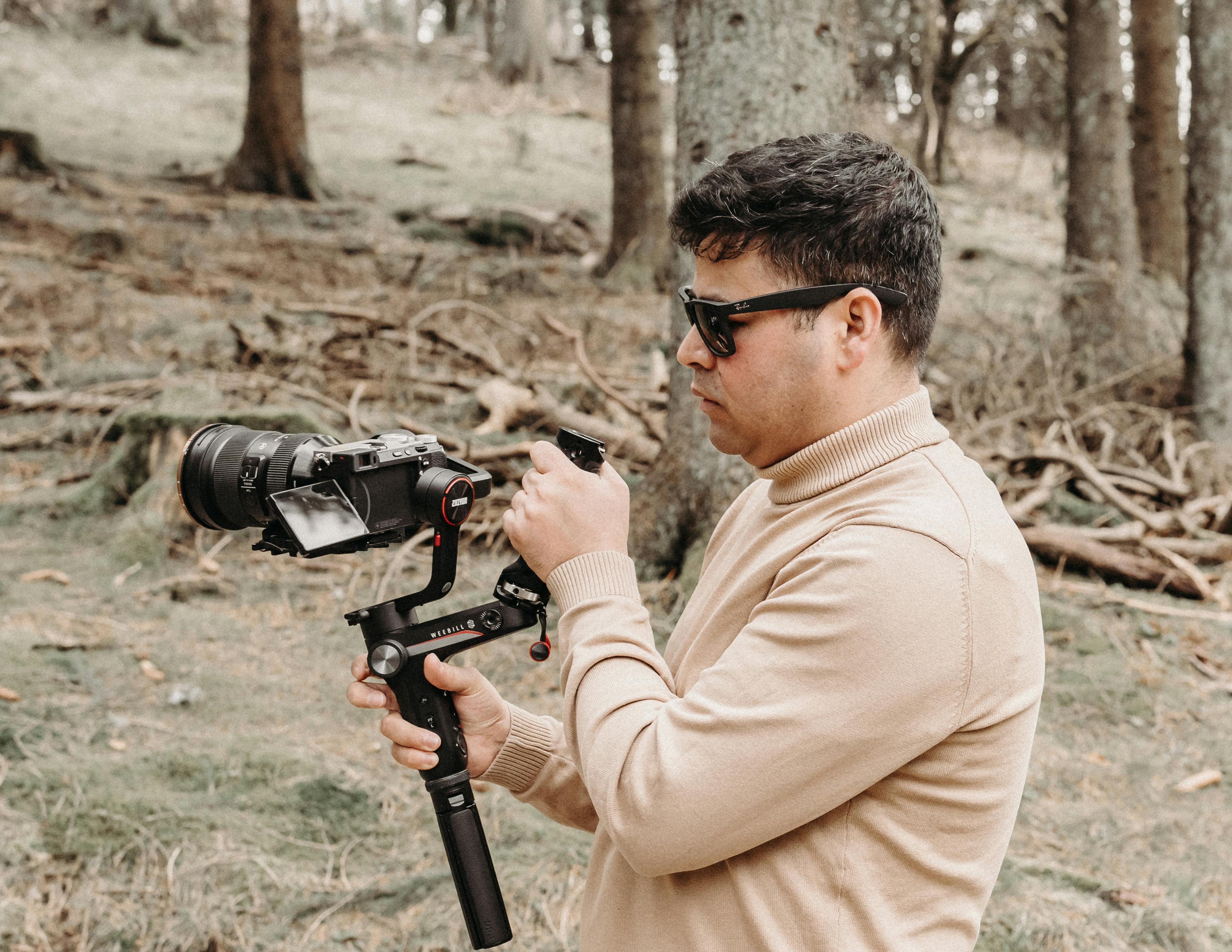 Man with Camera in a Forest · Free Stock Photo