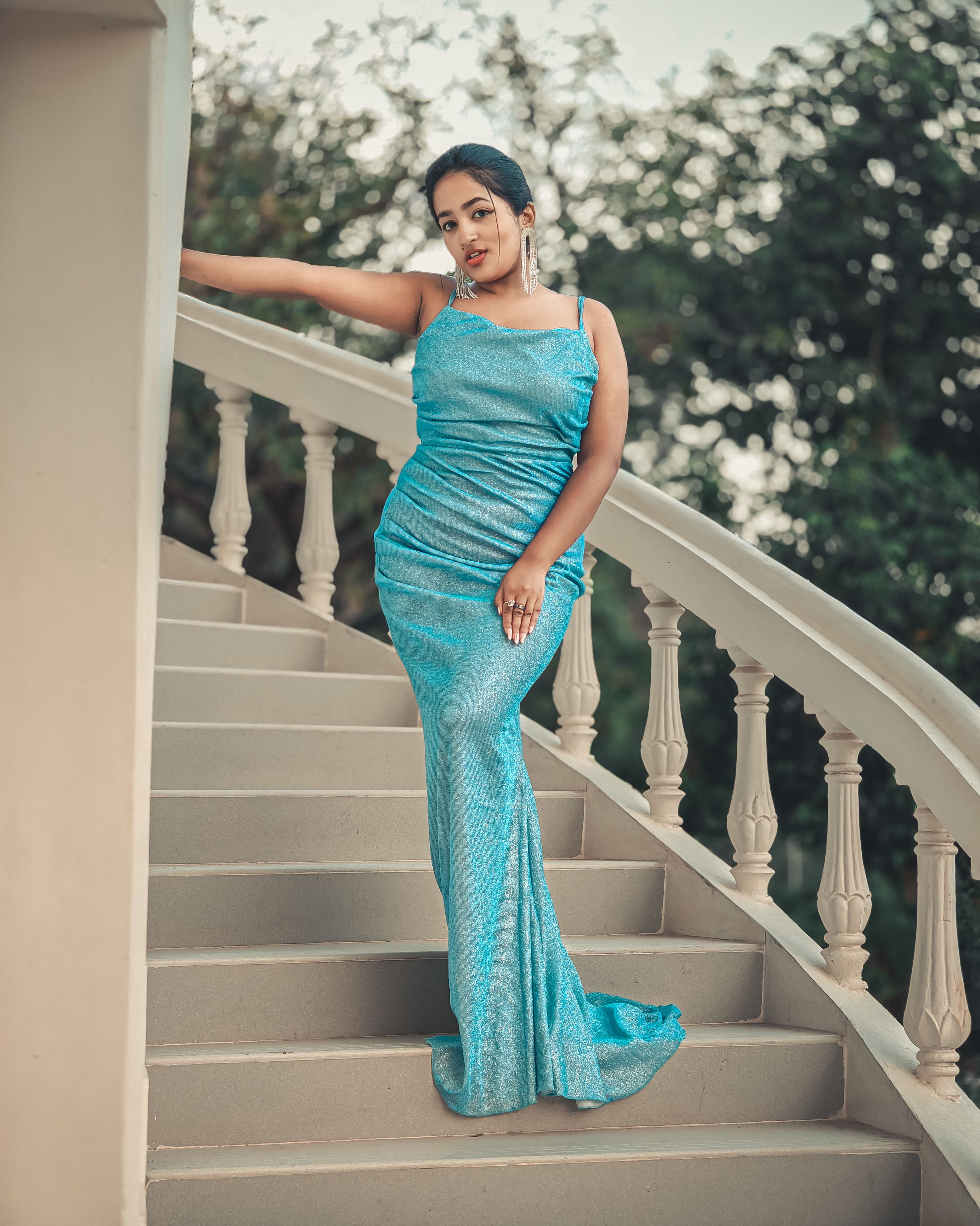 Woman in Blue Dress Standing on Stairs · Free Stock Photo