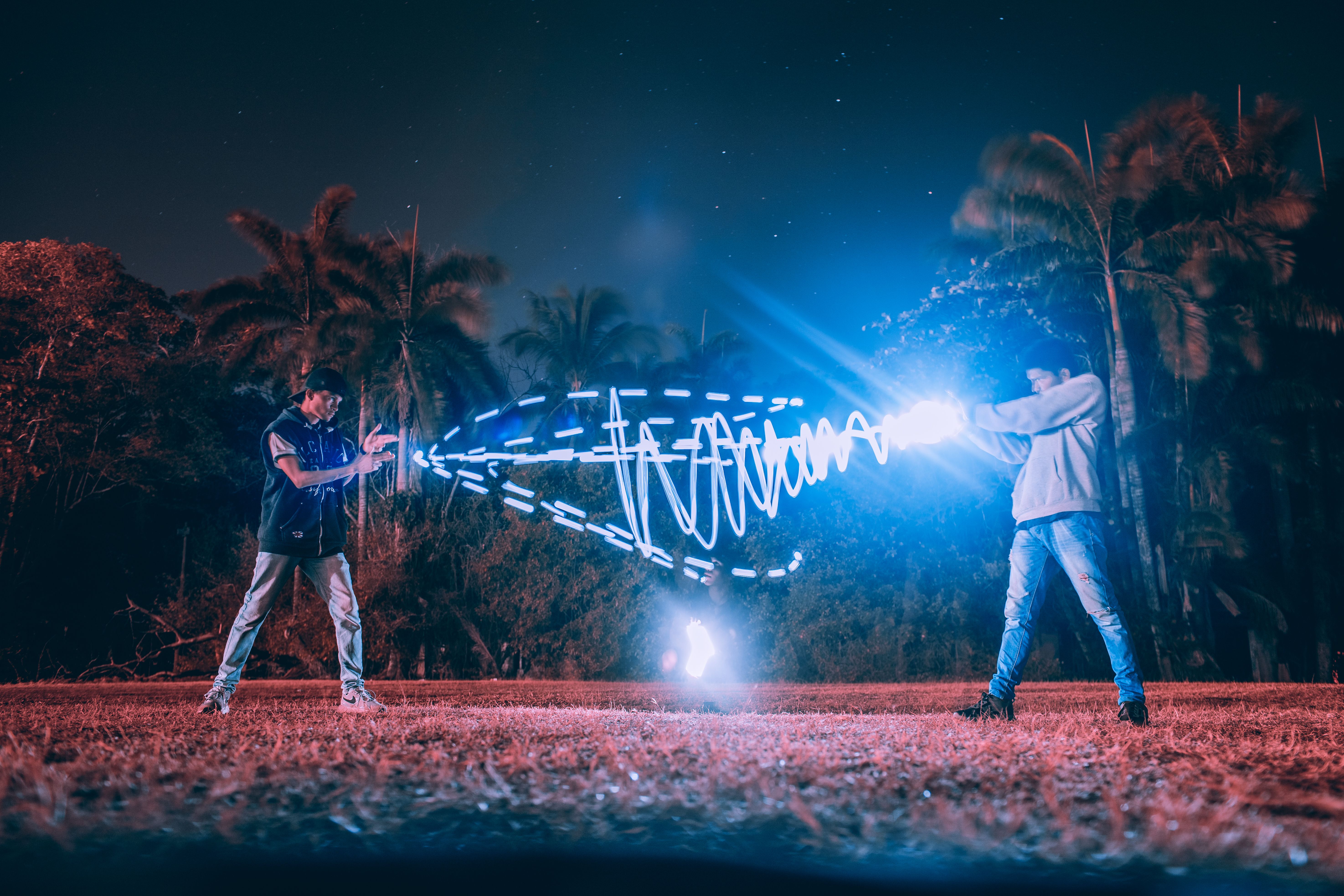 Two Man Standing on Ground during Dusk · Free Stock Photo
