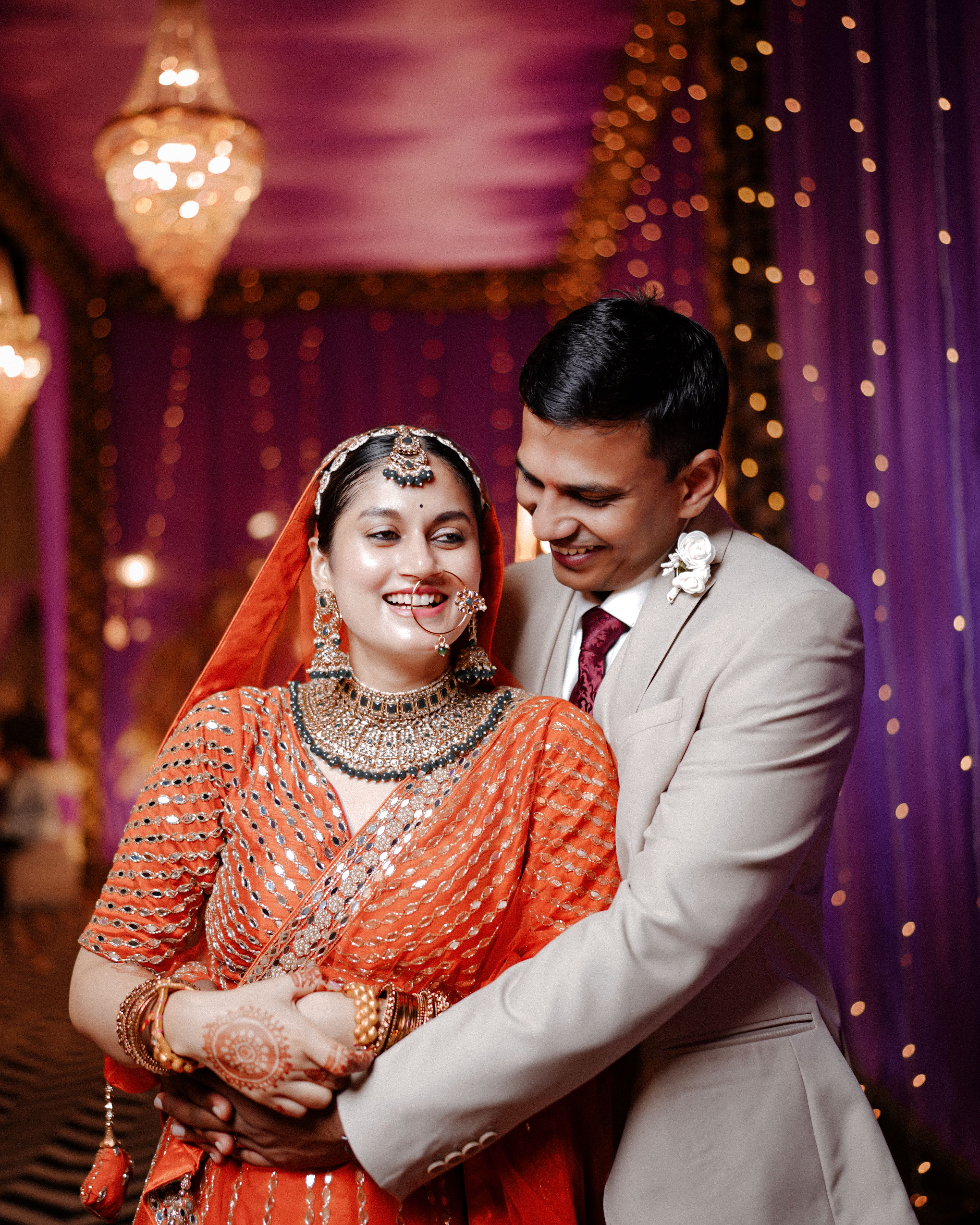 Smiling Newlyweds in Suit and Traditional Clothing · Free Stock Photo