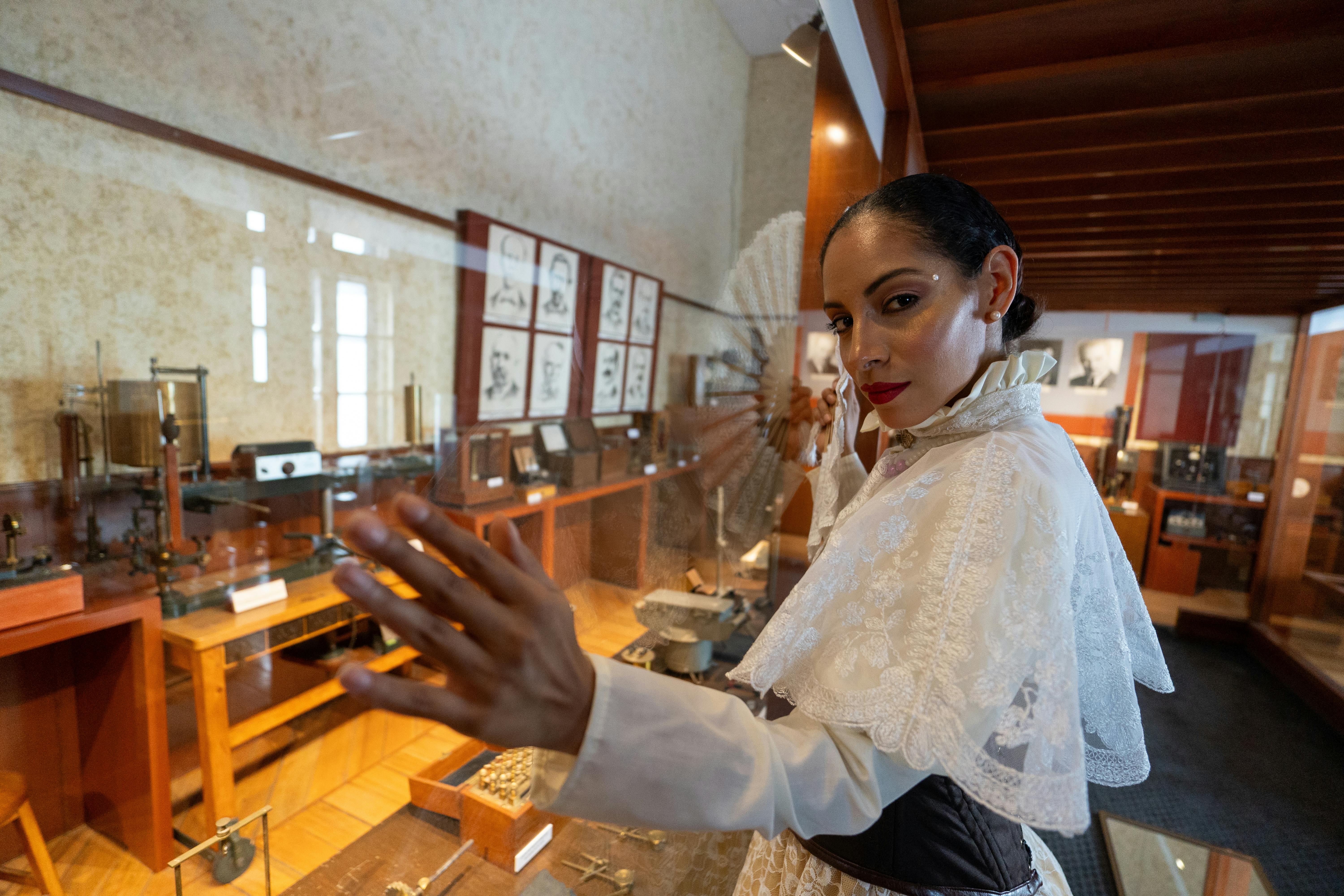 Elegant Woman Posing in a Museum · Free Stock Photo