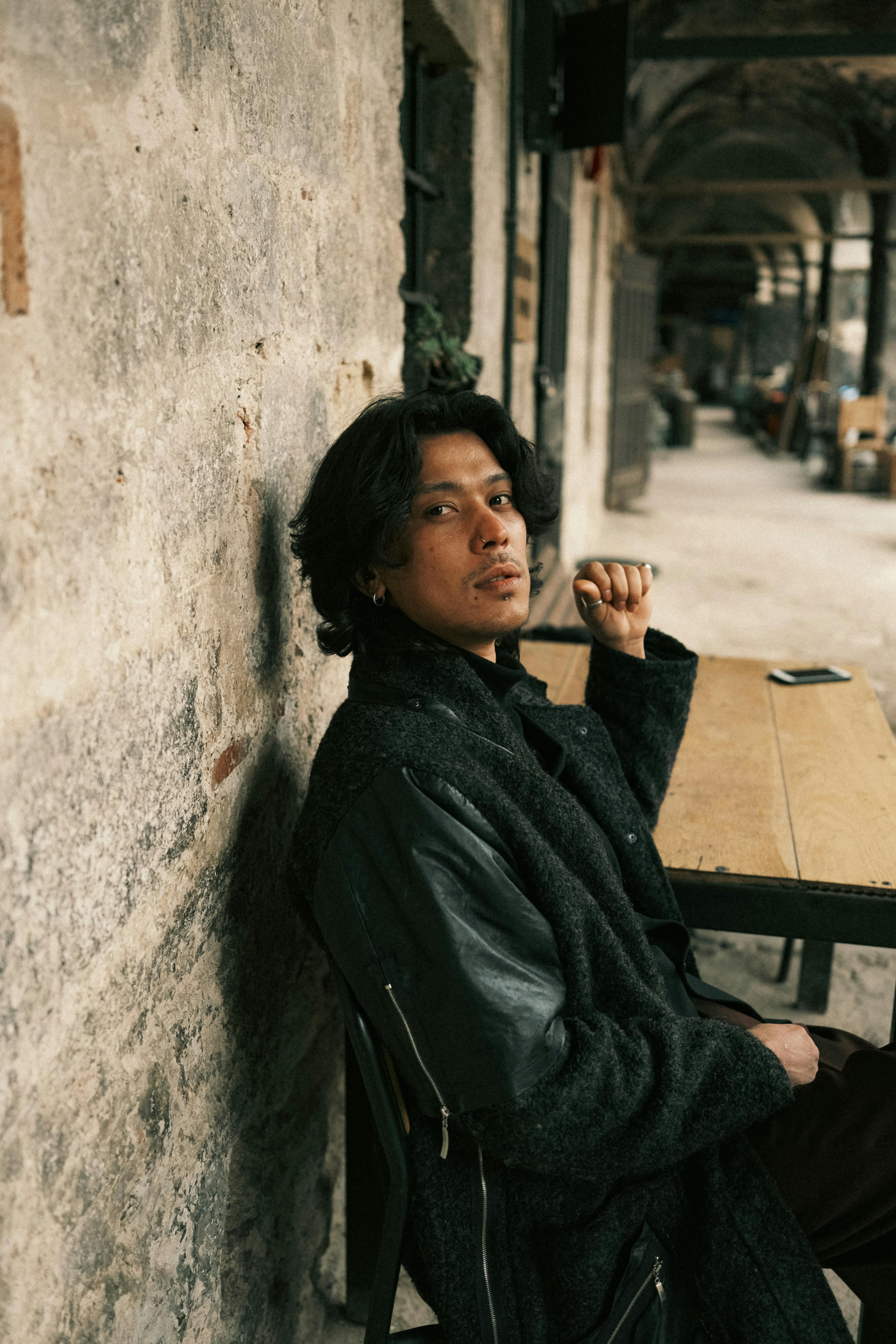 Man Sitting next to Table · Free Stock Photo