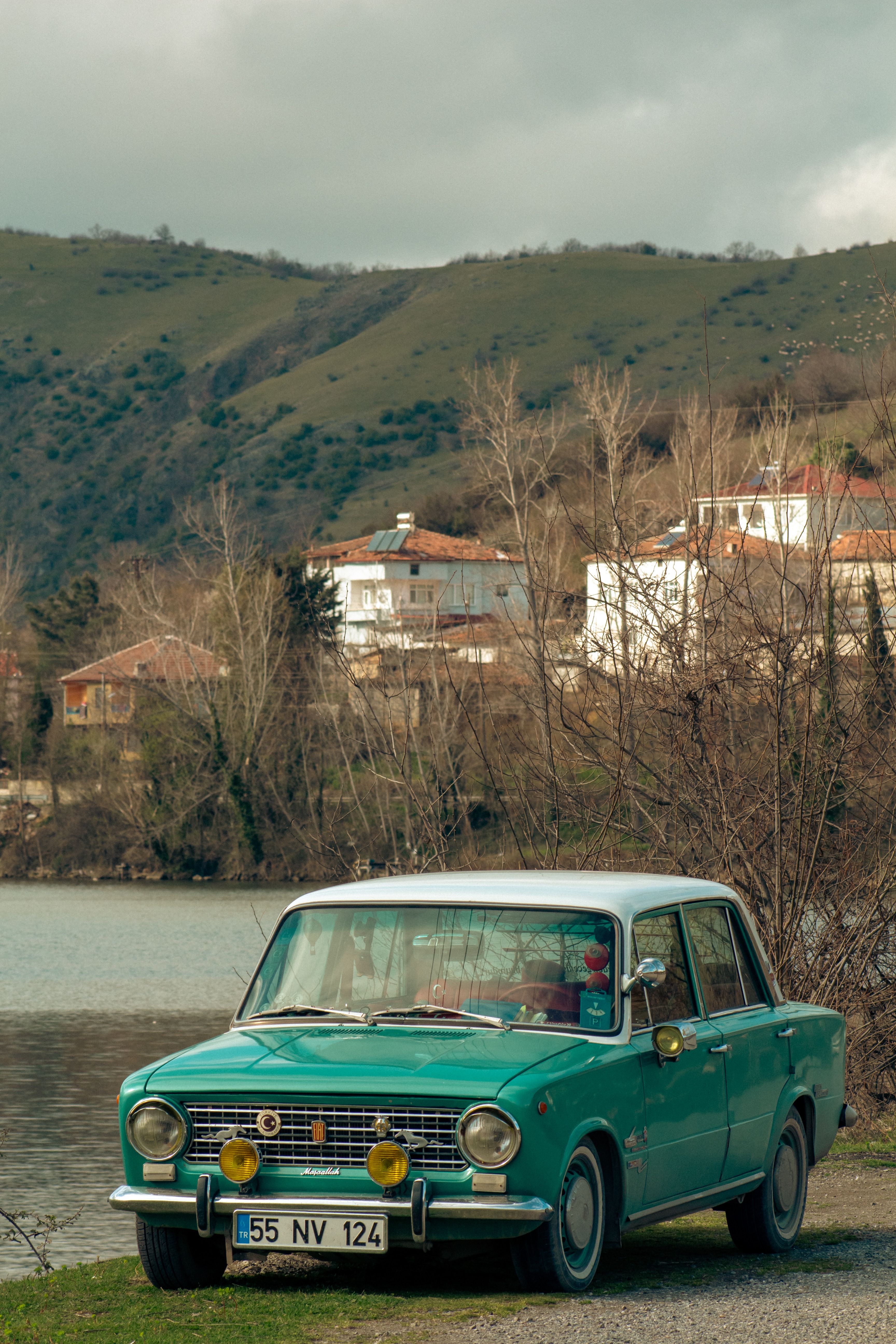 Green Old-fashioned Car by Lake in Countryside · Free Stock Photo
