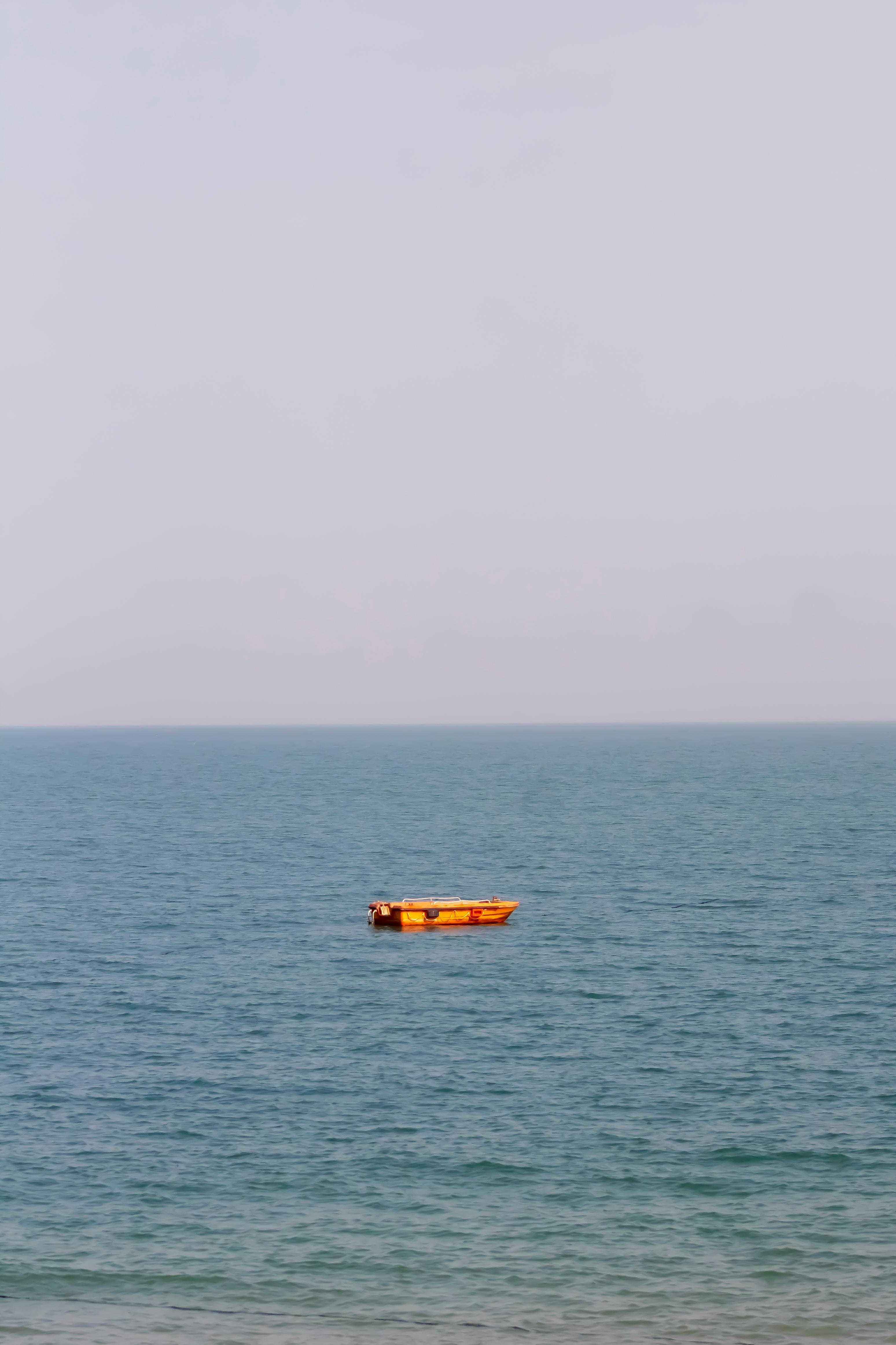 An Empty Boat Drifting in the Sea · Free Stock Photo