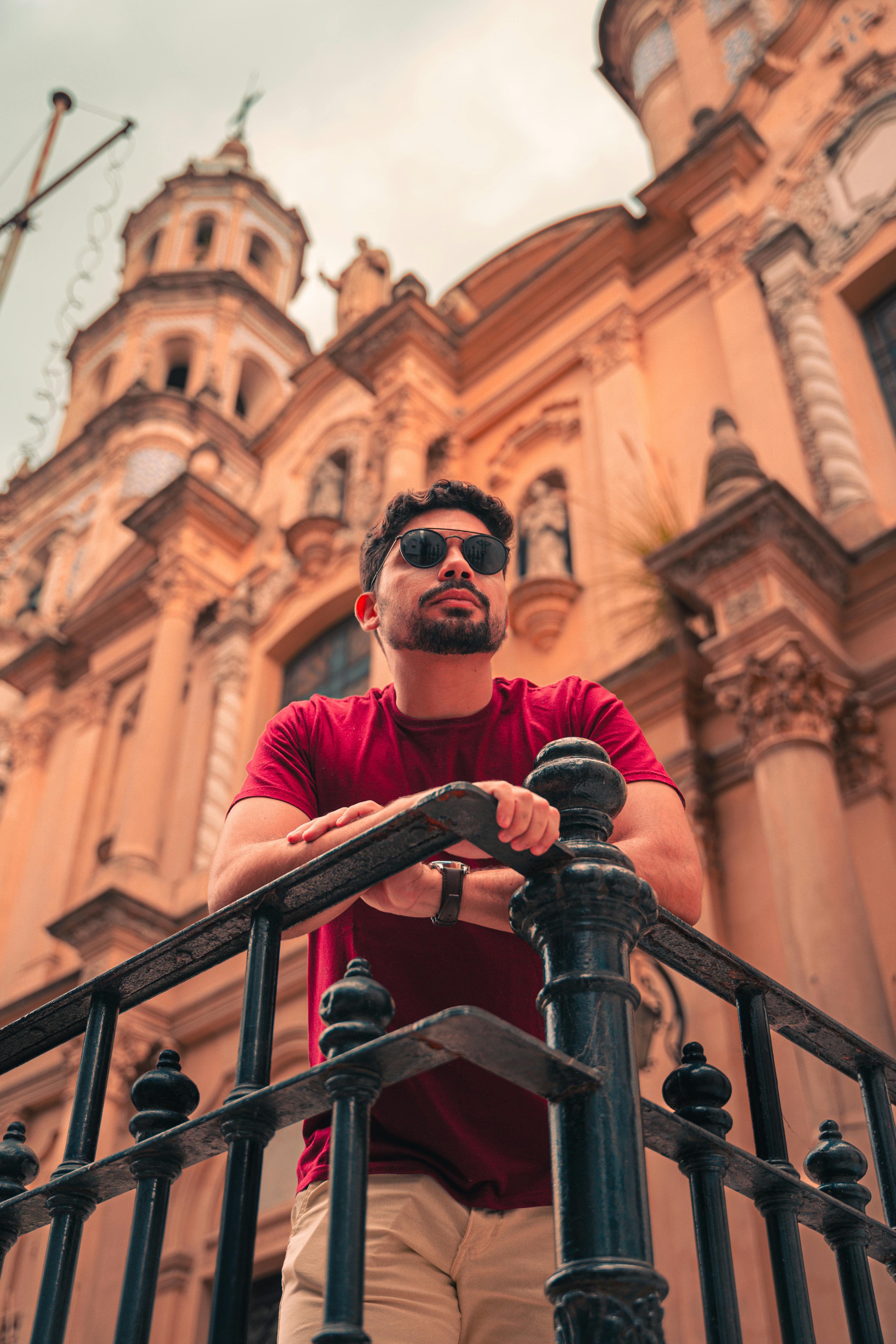 Handsome Man with Sunglasses Posing on Terrace Near Church · Free Stock ...