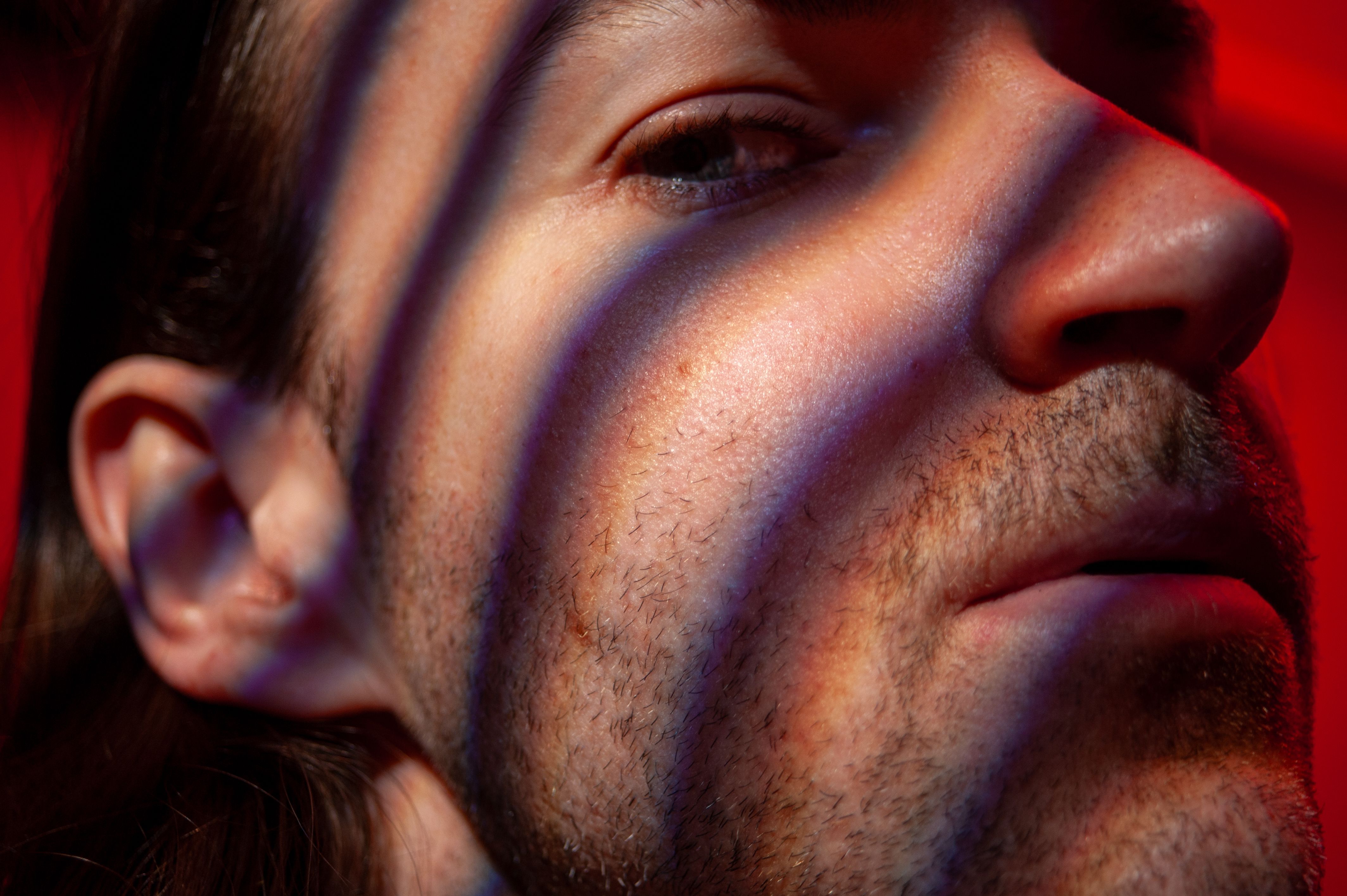 Man with Striped Blinds Shadow on His Face · Free Stock Photo