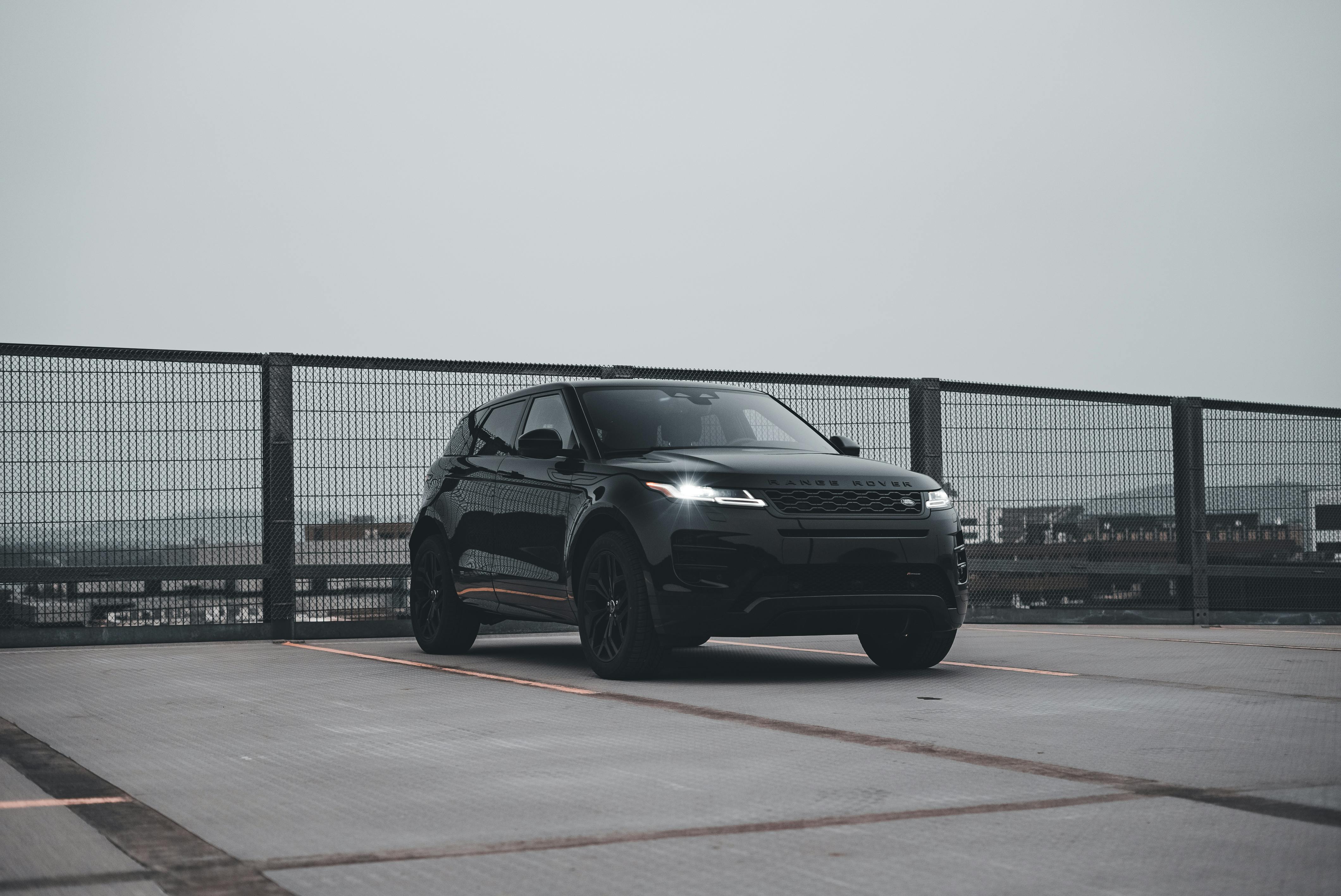 Land Rover Parked on Rooftop Parking Lot · Free Stock Photo