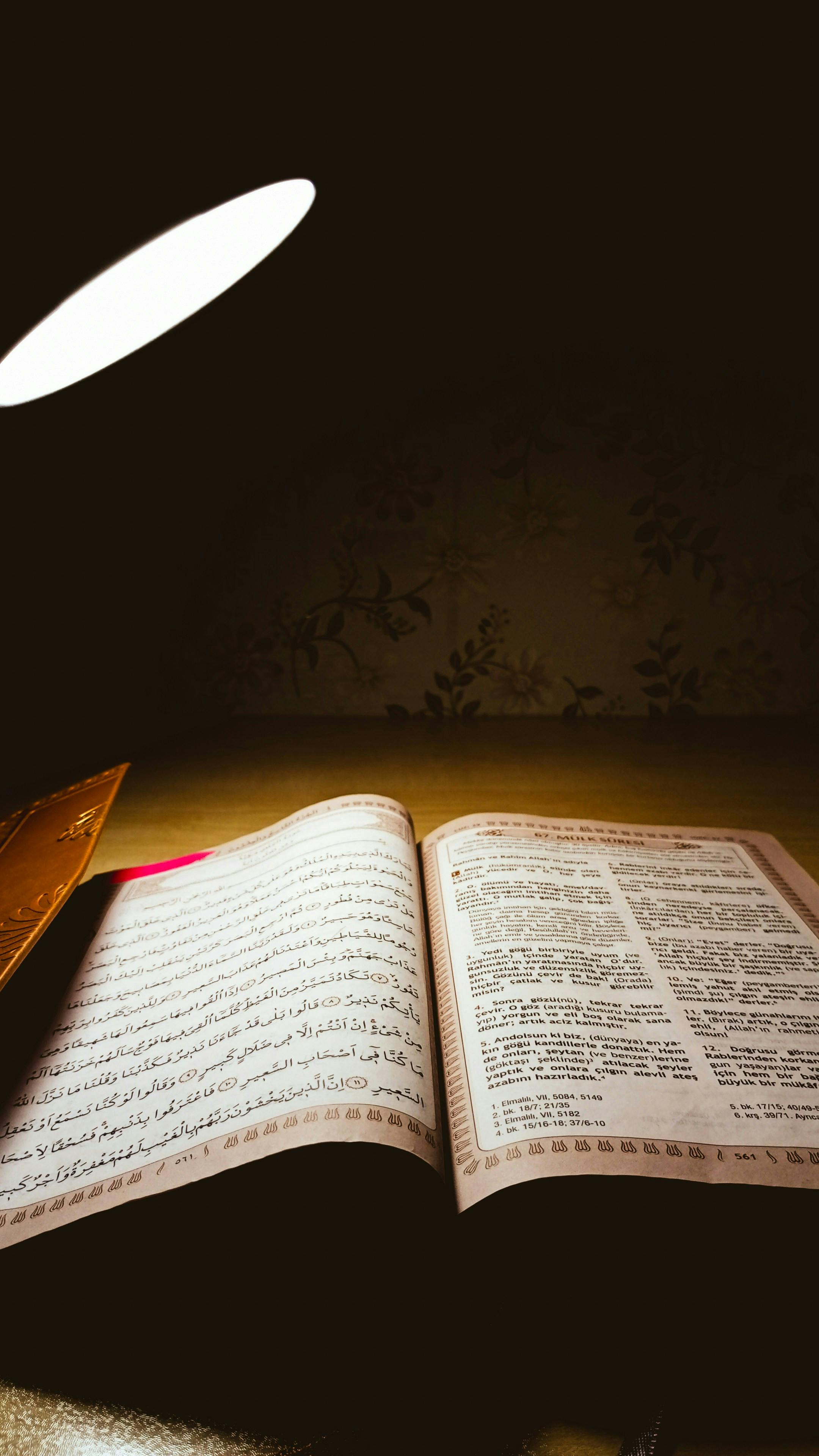 Open Quran Under Lamp Light for Ramadan Reflection · Free Stock Photo