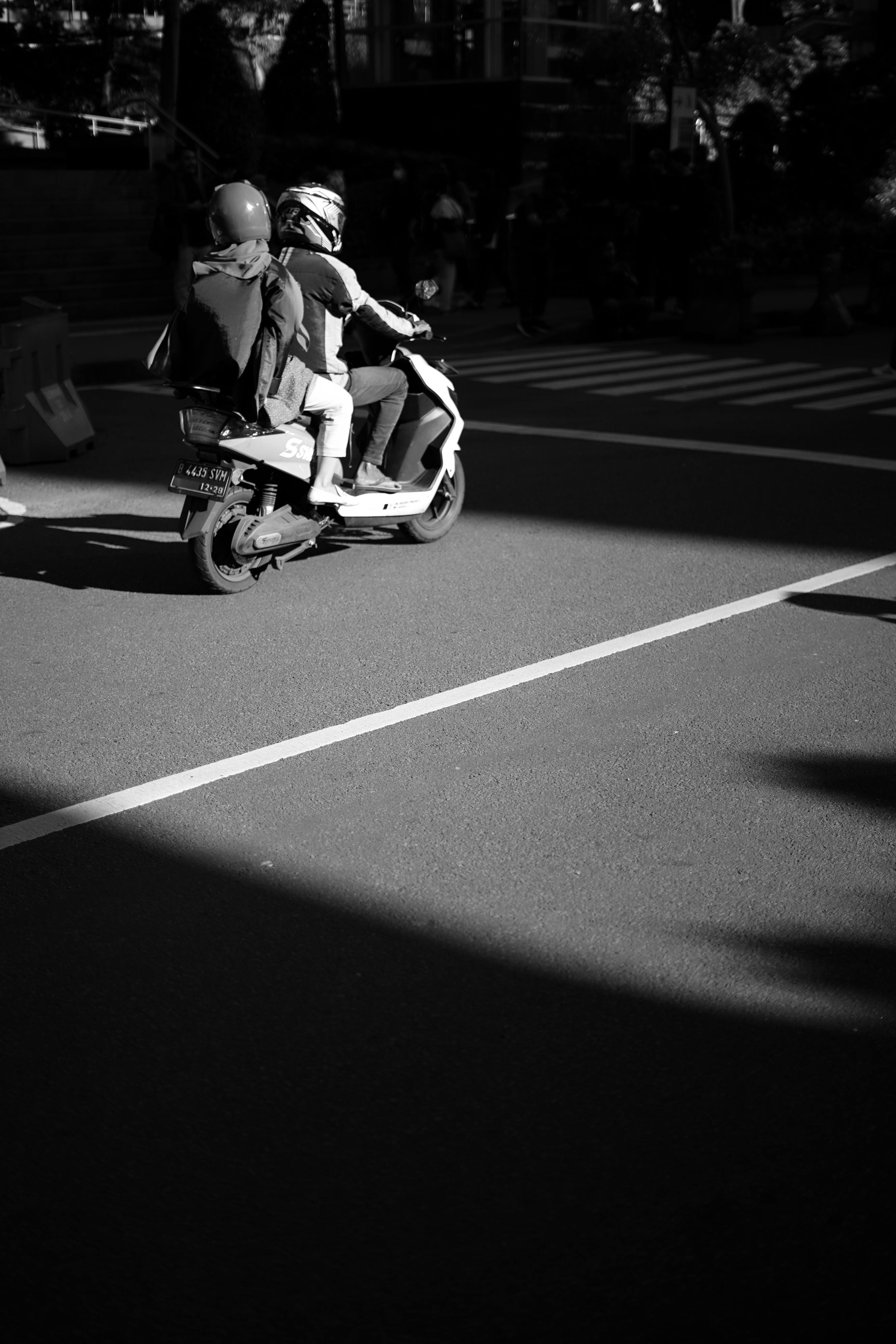 People Riding Motor Scooter on Street in Jakarta · Free Stock Photo