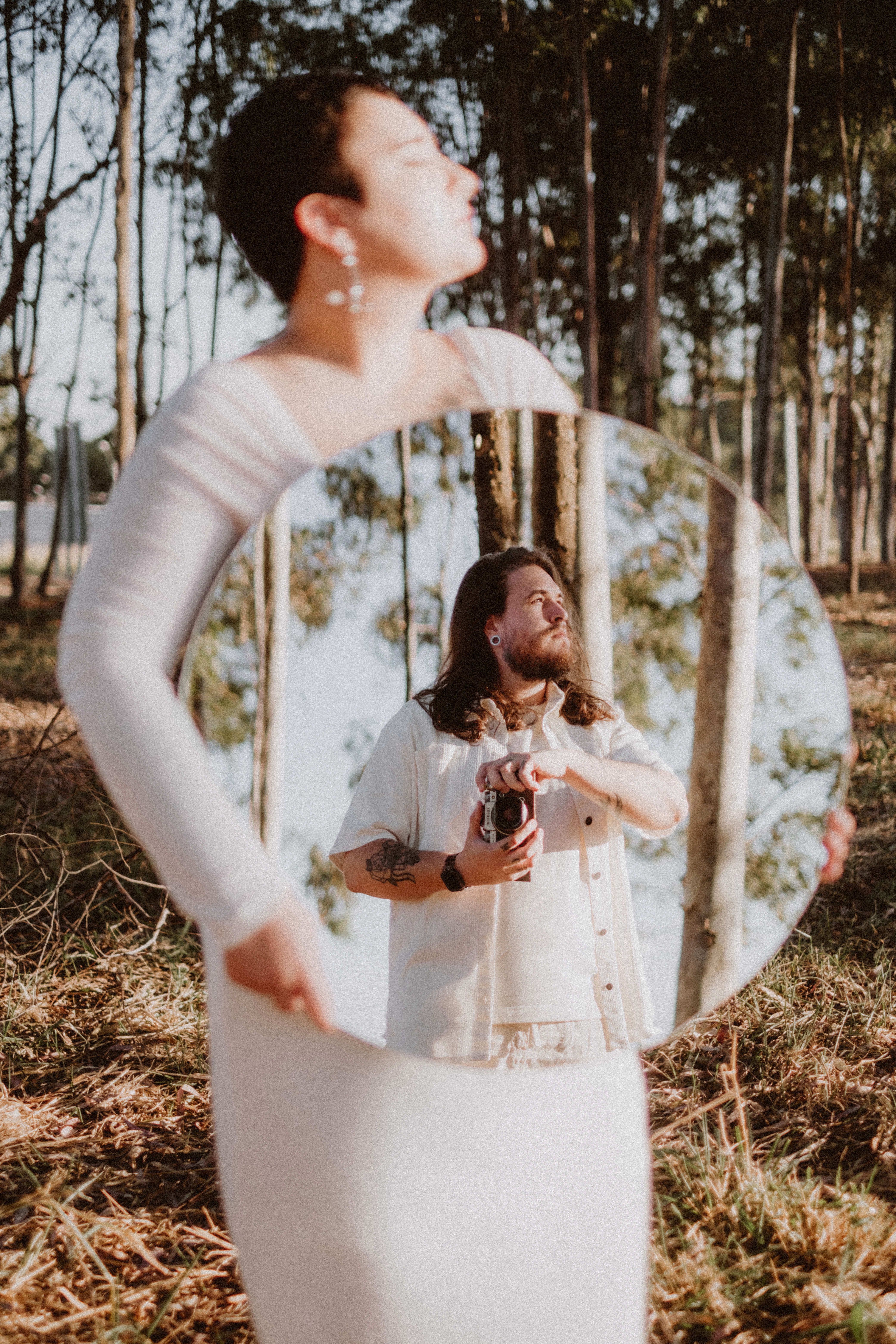 Woman Standing and Holding Mirror with Reflection of Man Taking ...