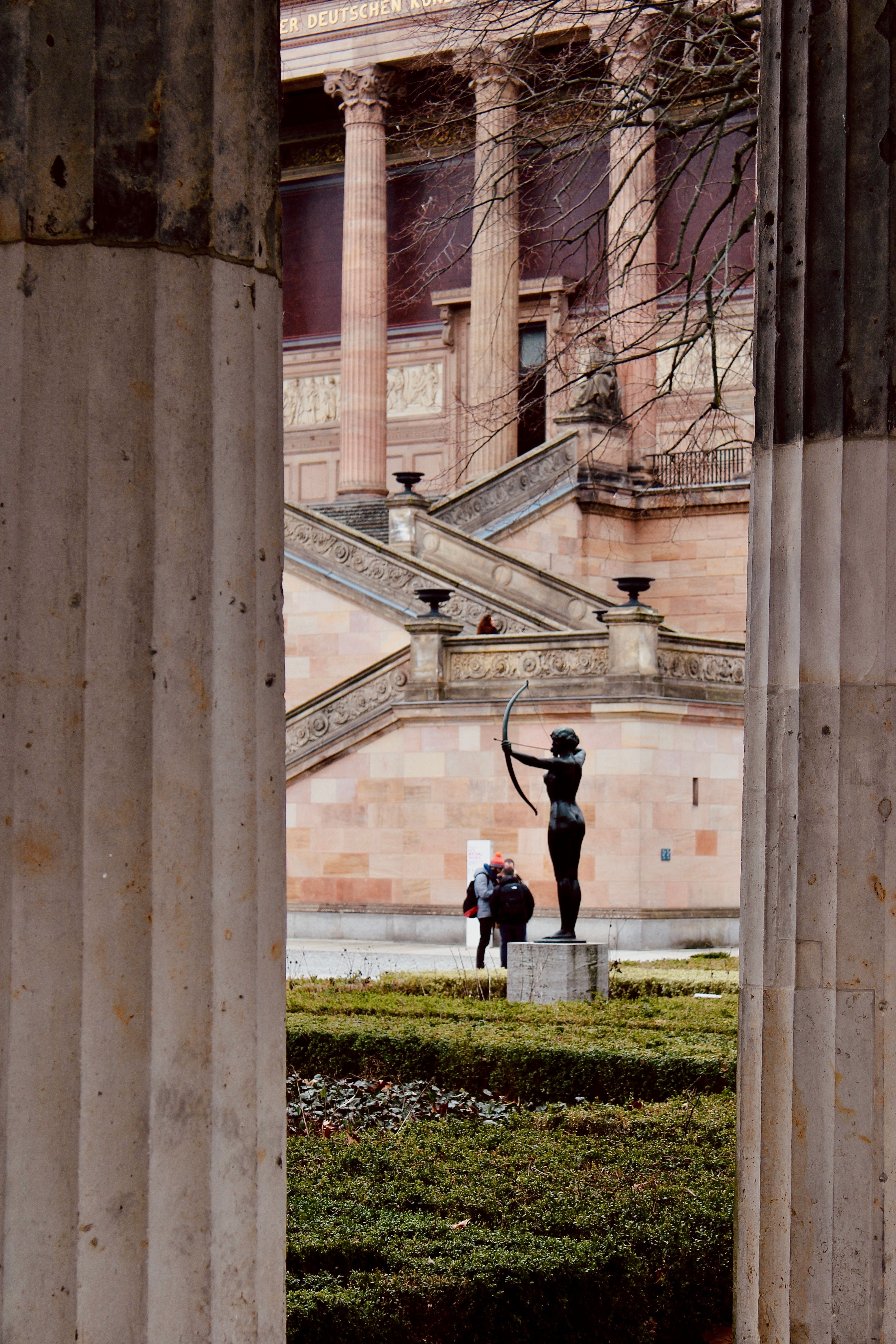 Statue of Archer on Courtyard of Ancient Building · Free Stock Photo