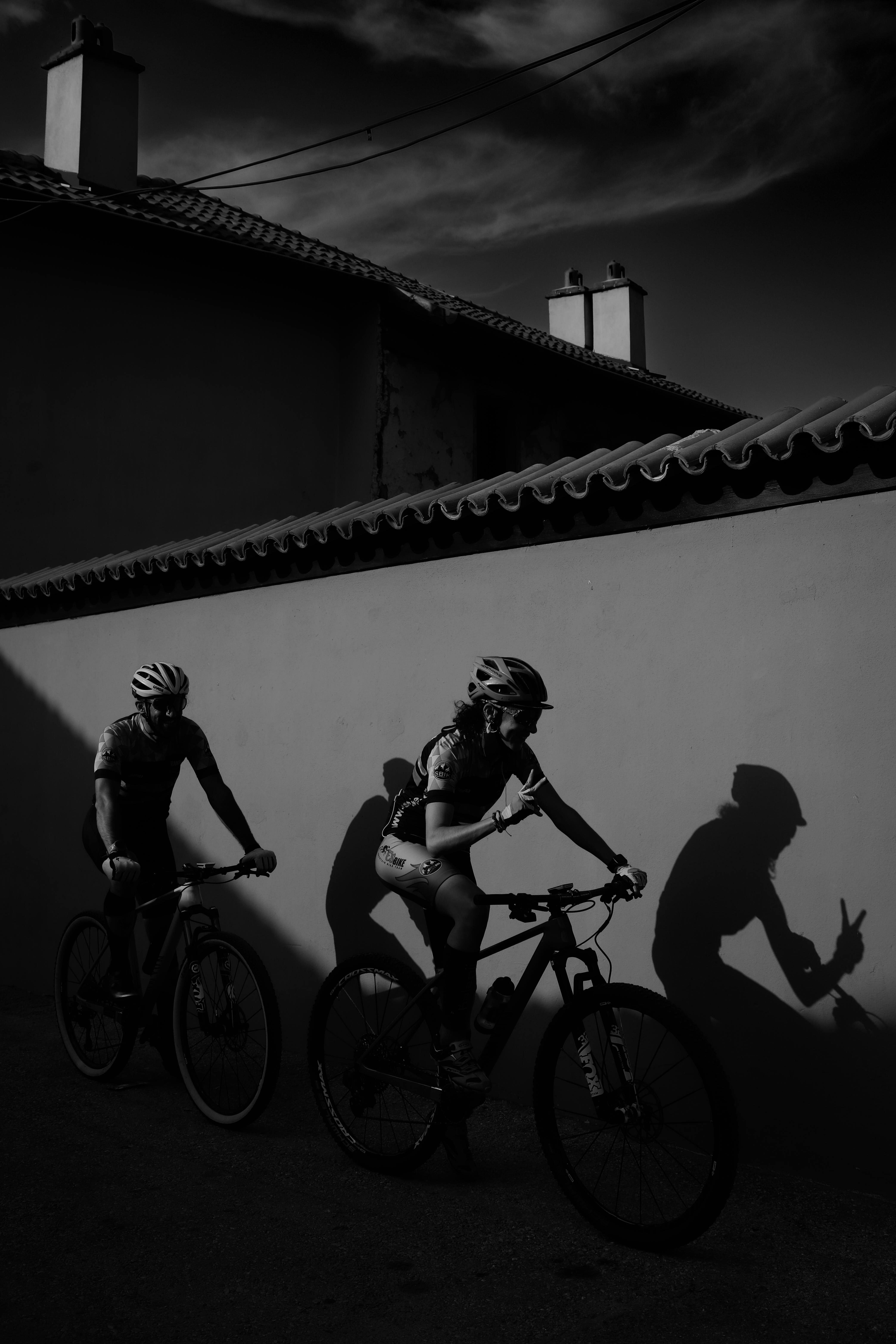 Woman and Man Riding Bicycles in Black and White · Free Stock Photo