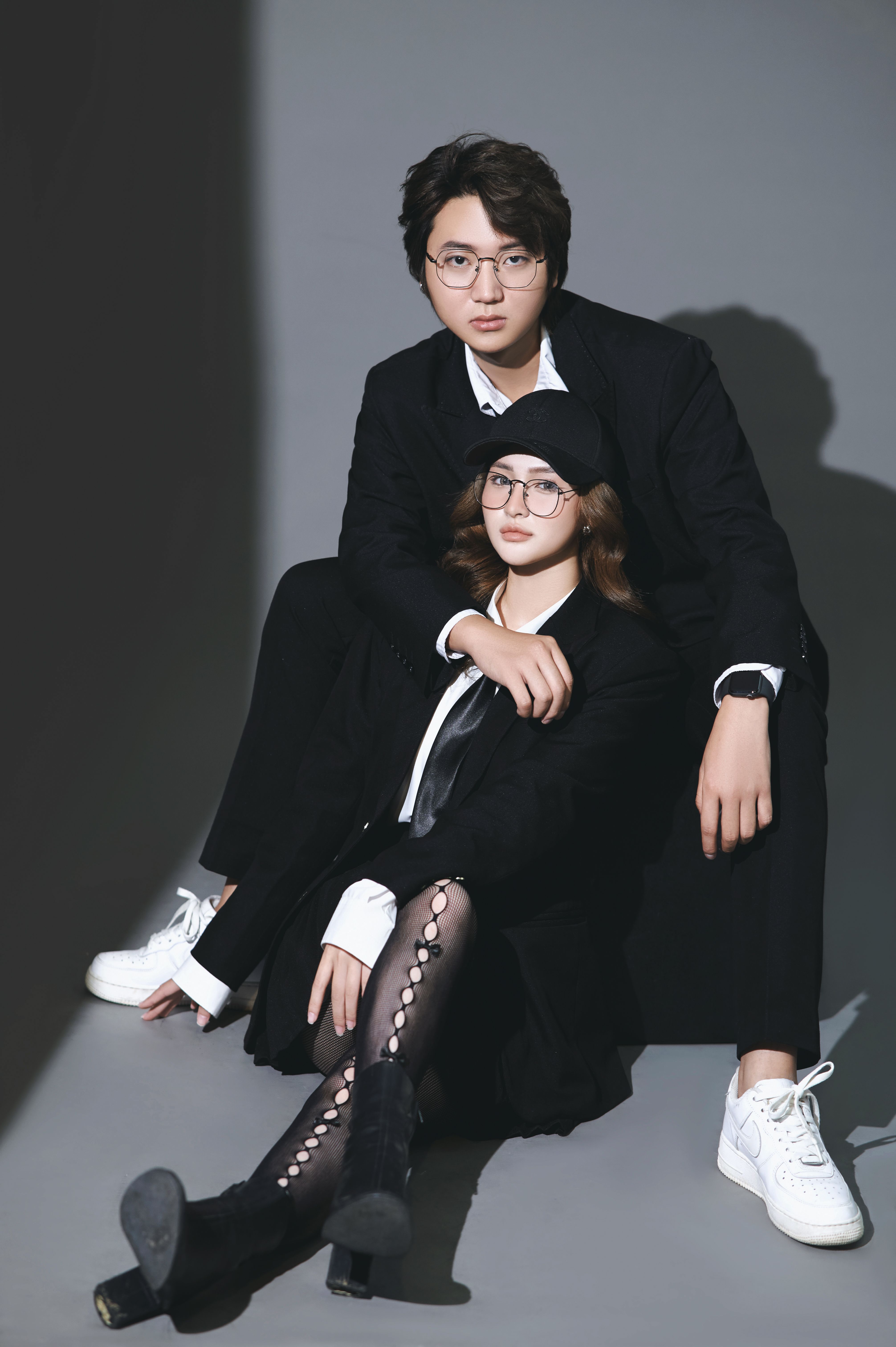 Woman and Man Sitting in Black Suits · Free Stock Photo