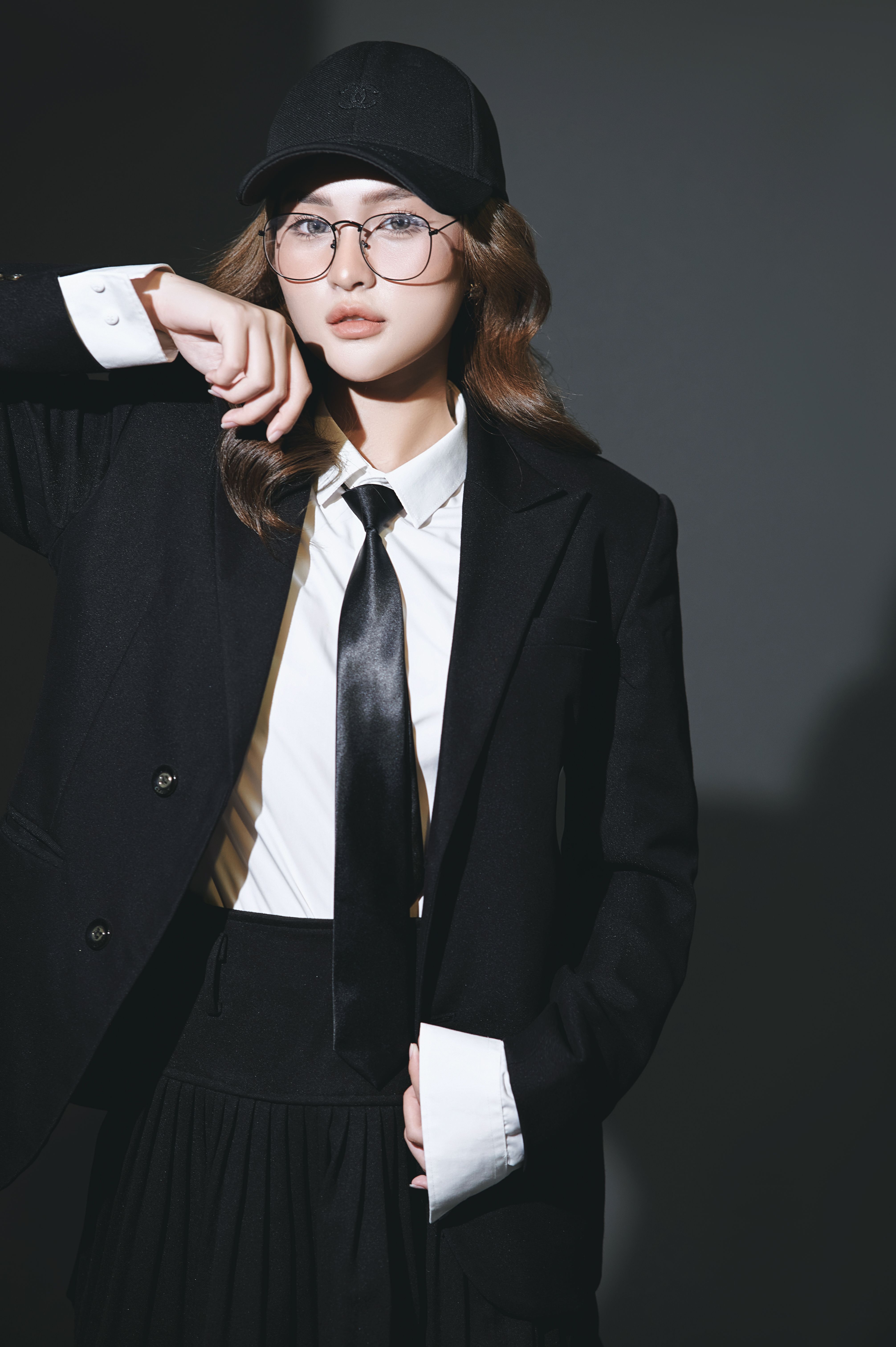 Portrait of Woman in Cap and Black Suit · Free Stock Photo