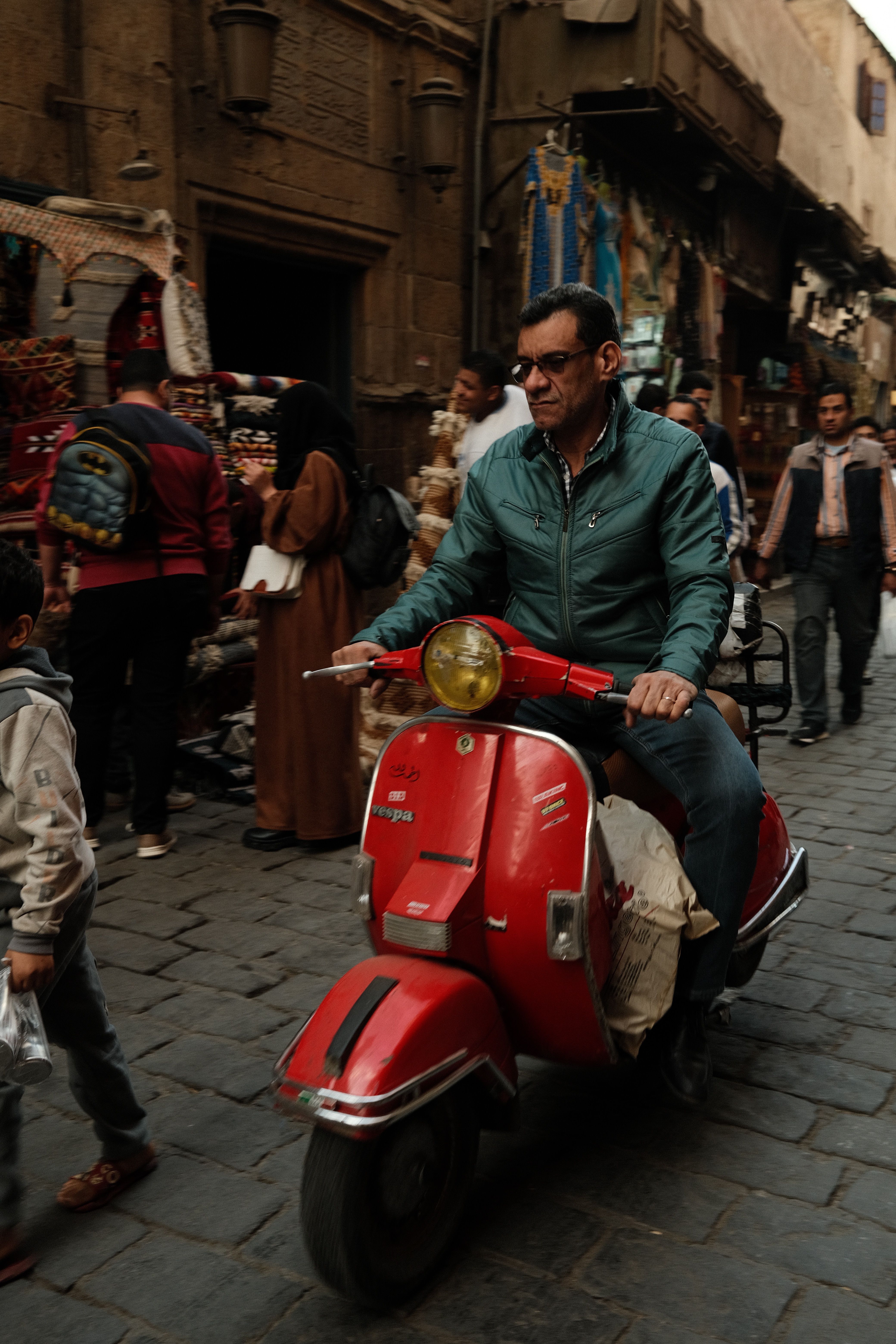 Man Riding Motor Scooter on Street in City · Free Stock Photo