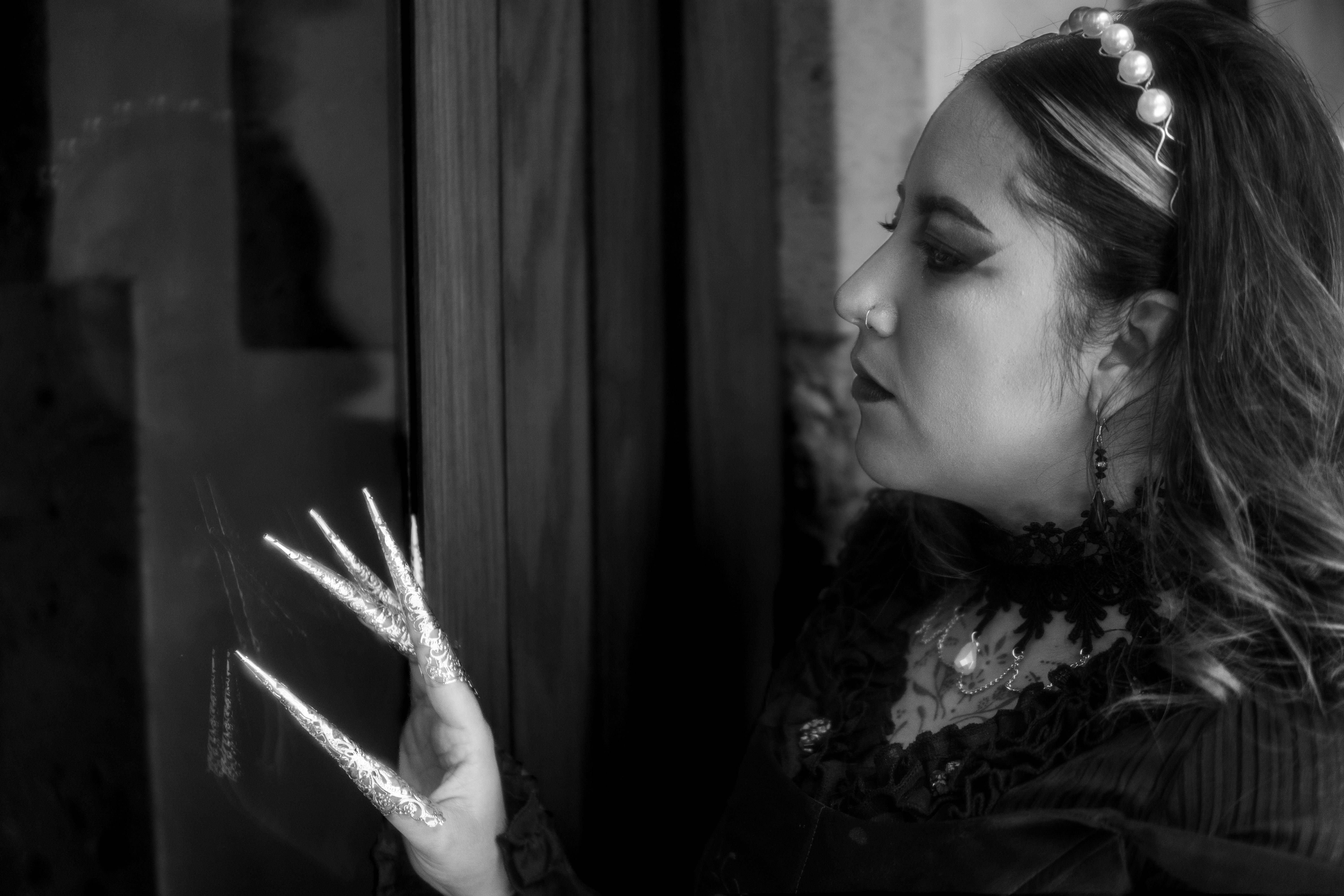 Black and White Photo of a Woman in a Costume and a Finger Claws ...