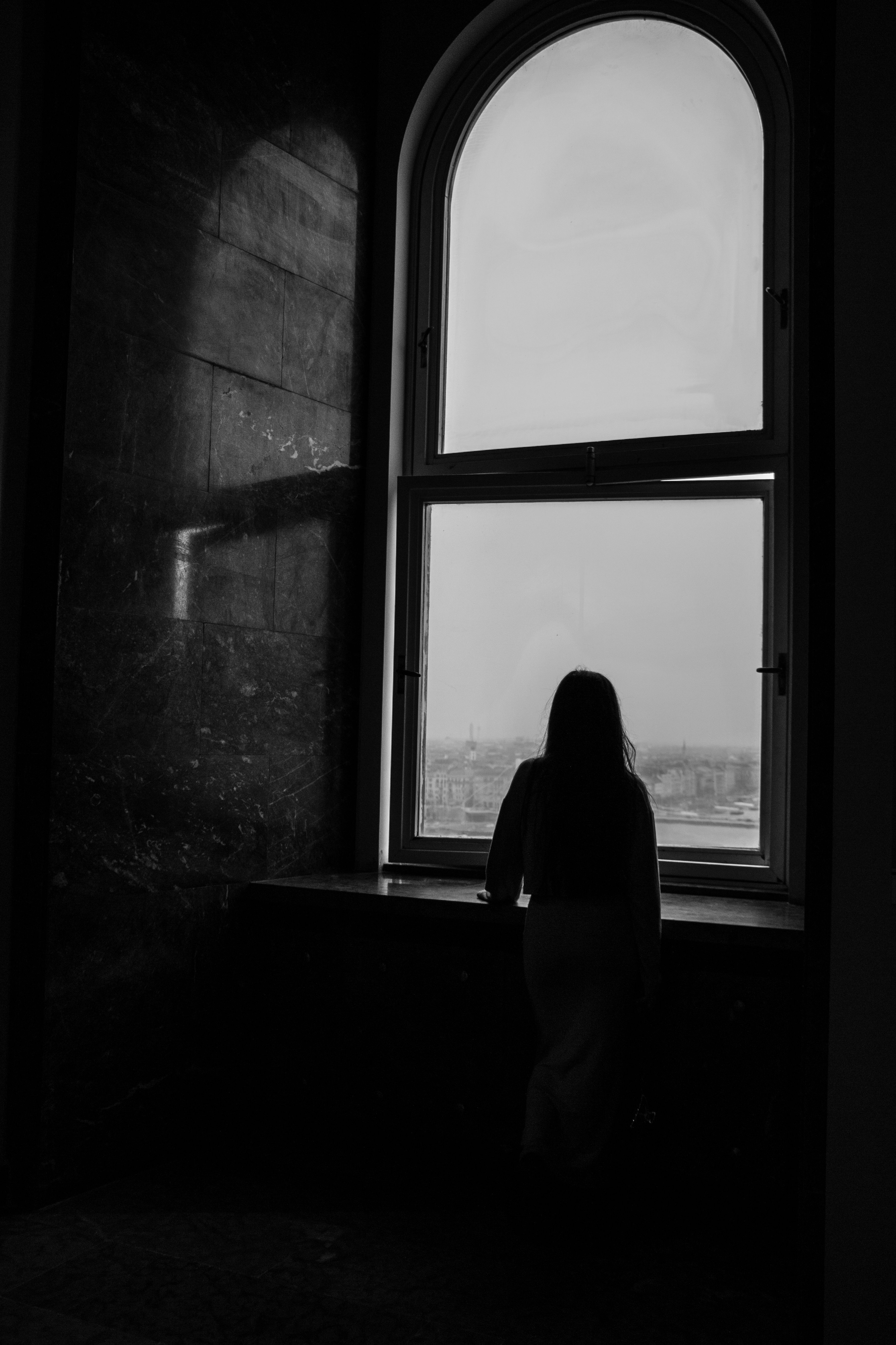 Silhouette of Woman Standing by Window in Room in Budapest · Free Stock ...