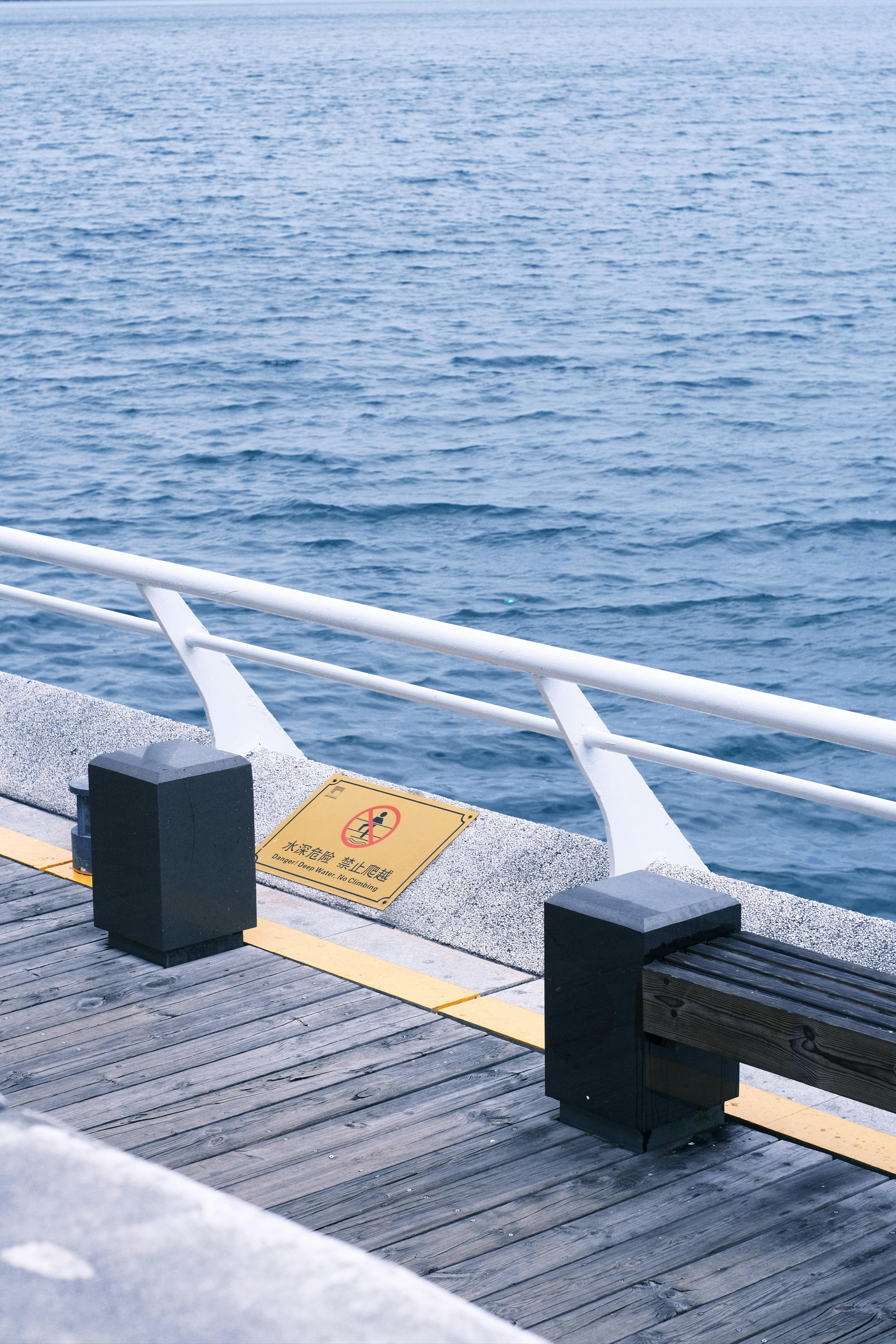 Railing on Pier on Sea Shore · Free Stock Photo