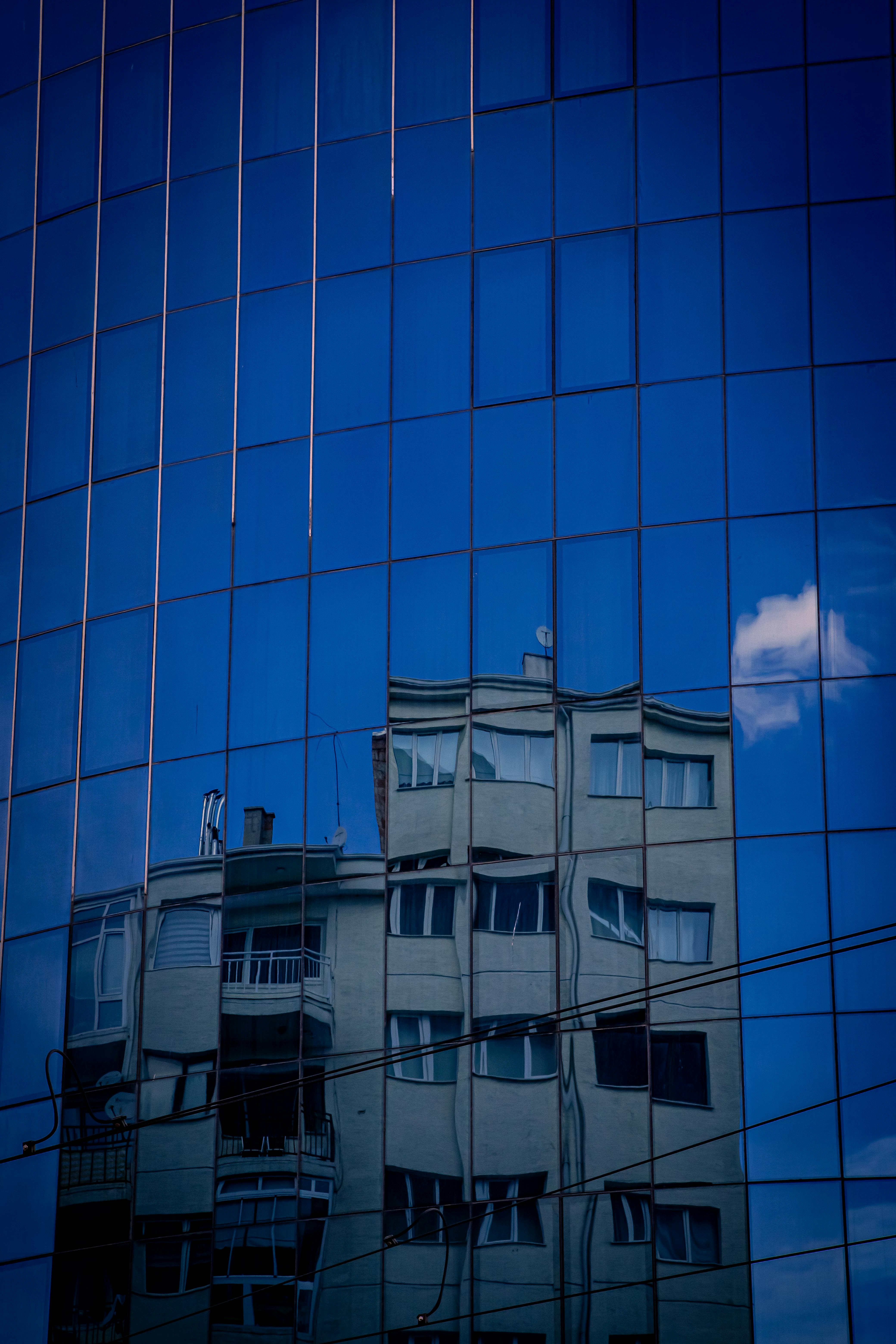 Building Reflection in Windows · Free Stock Photo