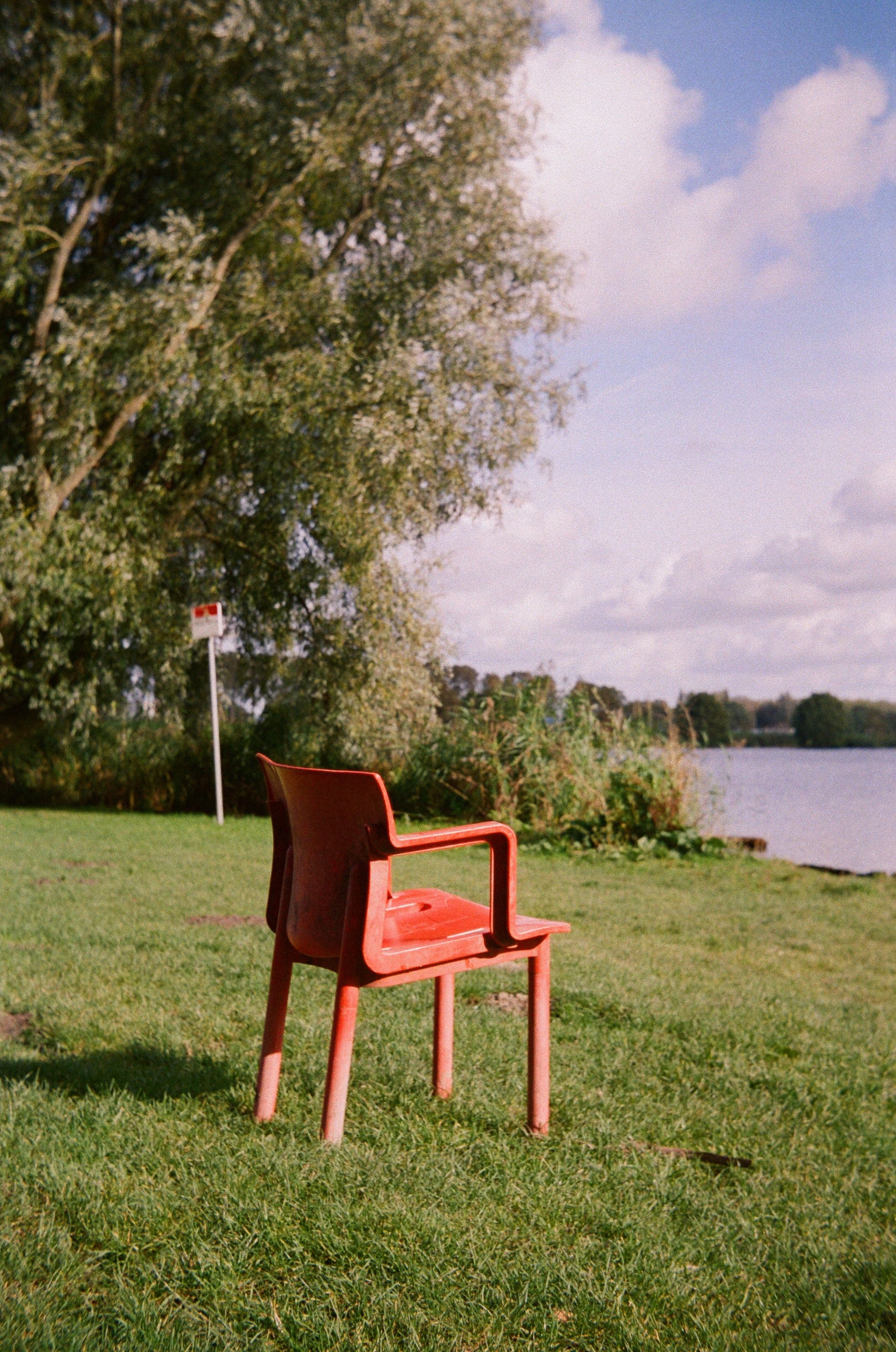 Chair on Grass on Lakeshore · Free Stock Photo