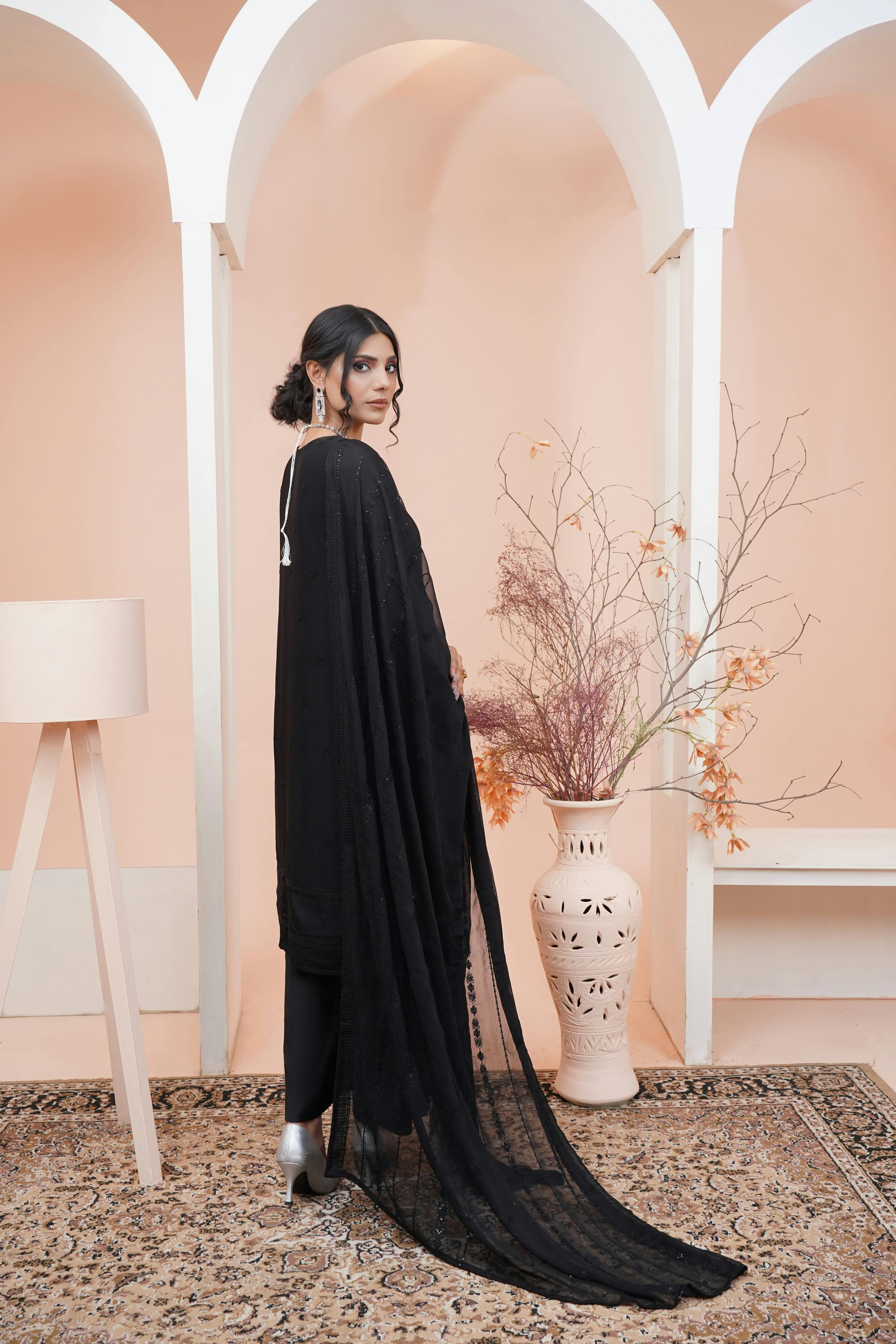 Model in Black Tunic Posing with Scarf · Free Stock Photo