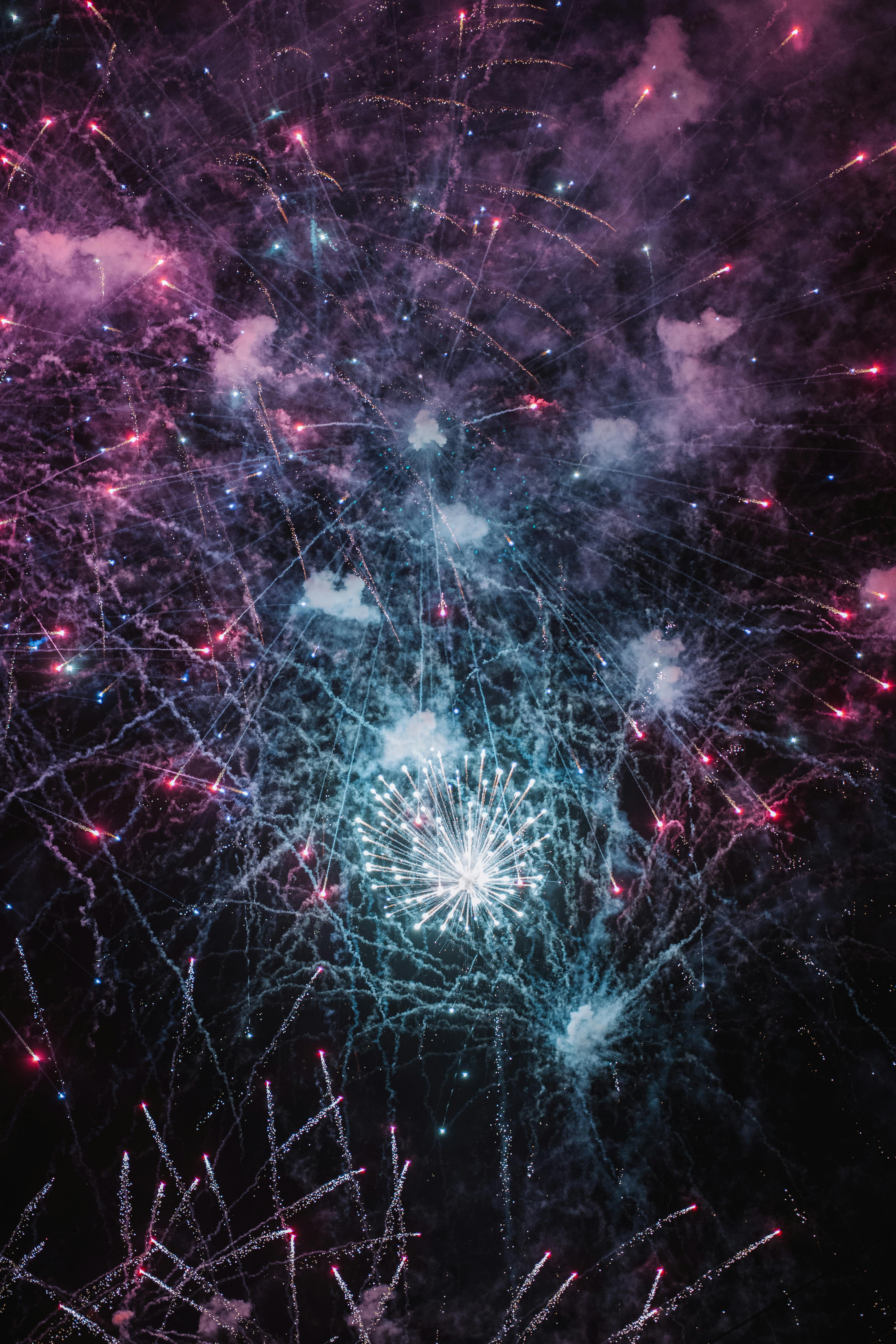 Bright firework with smoke cloud in dark sky at night · Free Stock Photo