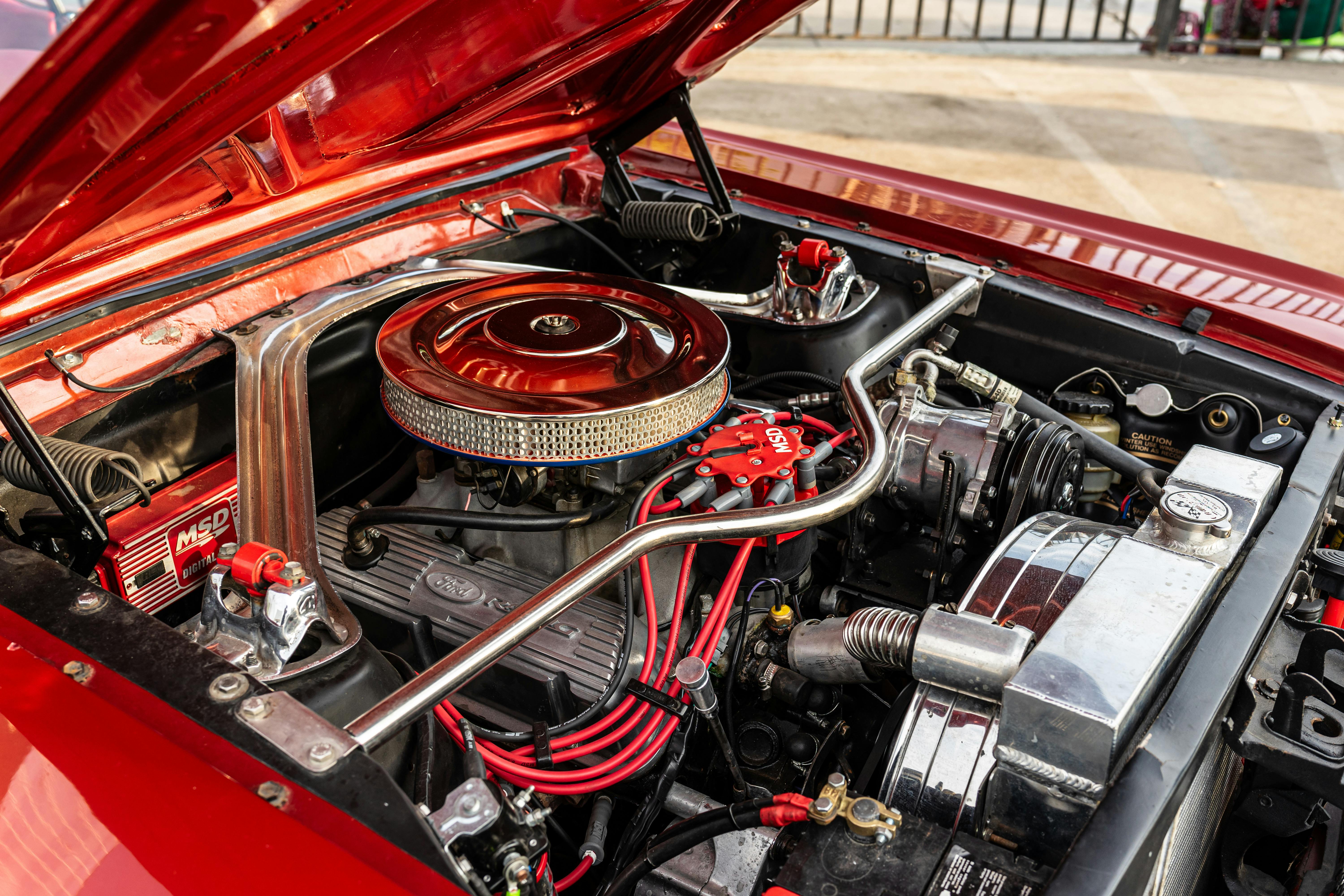 Engine and Car Parts under Open Hood · Free Stock Photo