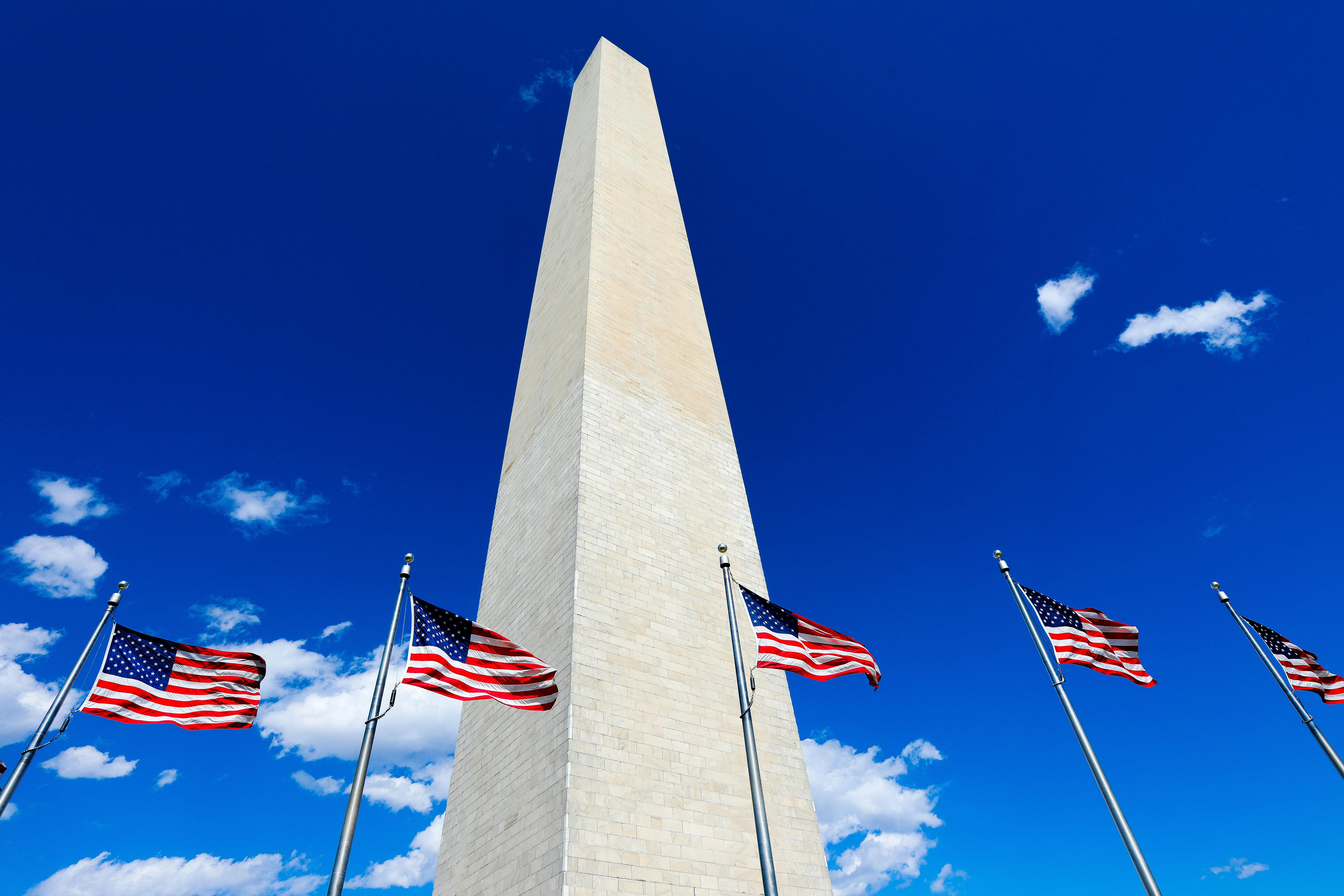 Flags of USA by Washington Monument in Washington DC · Free Stock Photo