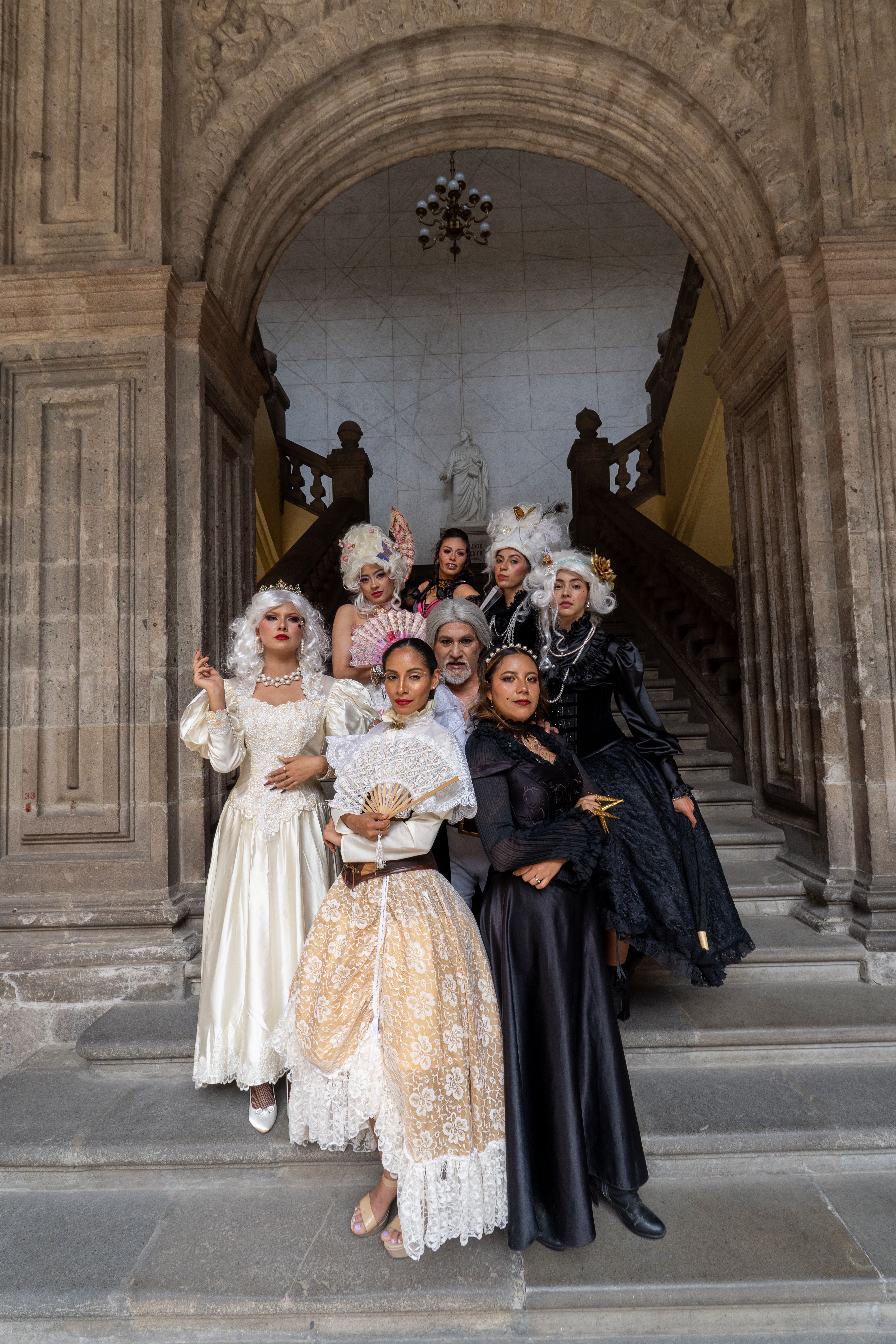 A group of women in period costumes posing for a photo · Free Stock Photo