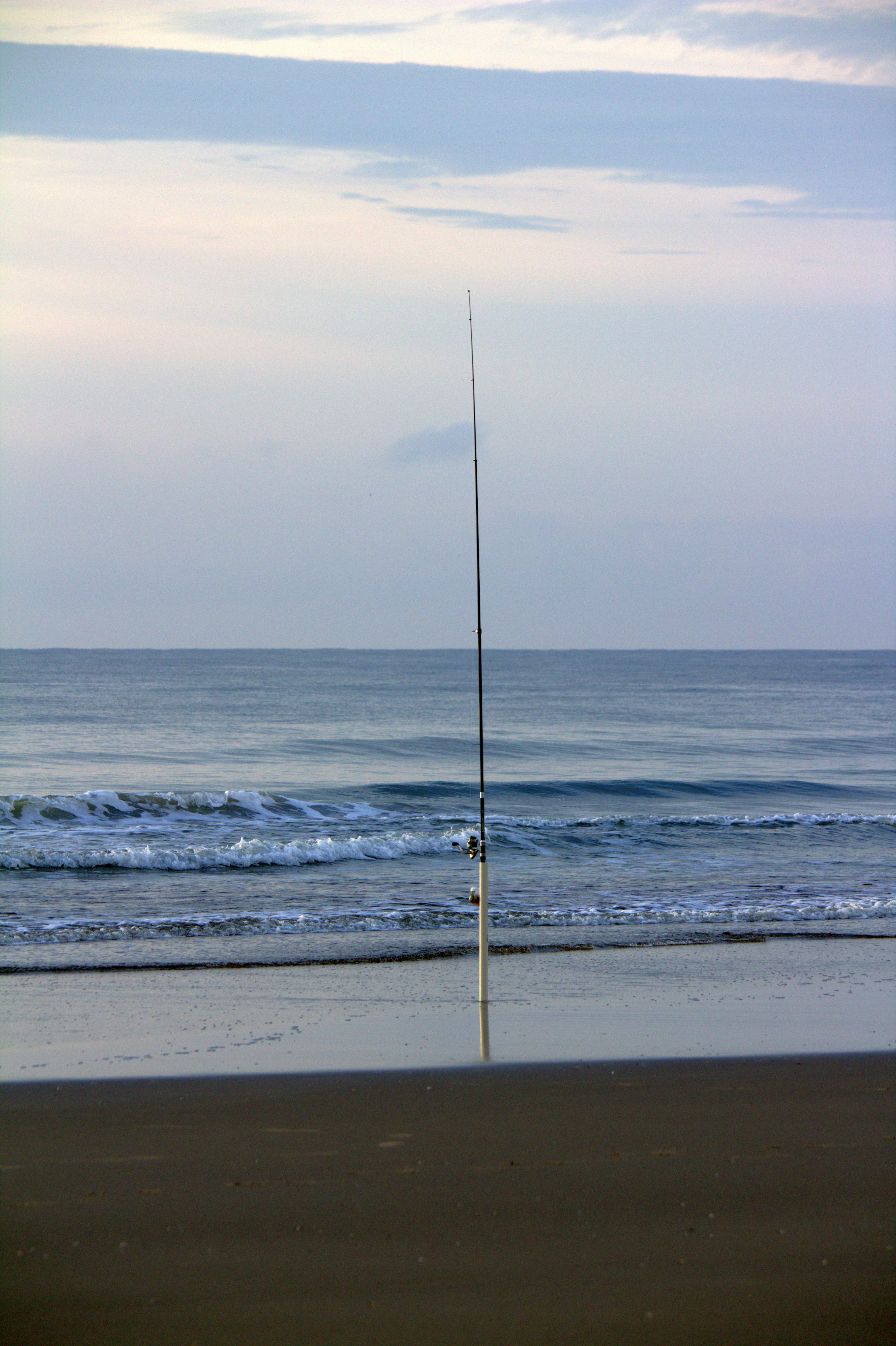 Seascape with Waves, and a Fishing Rod on a Beach · Free Stock Photo