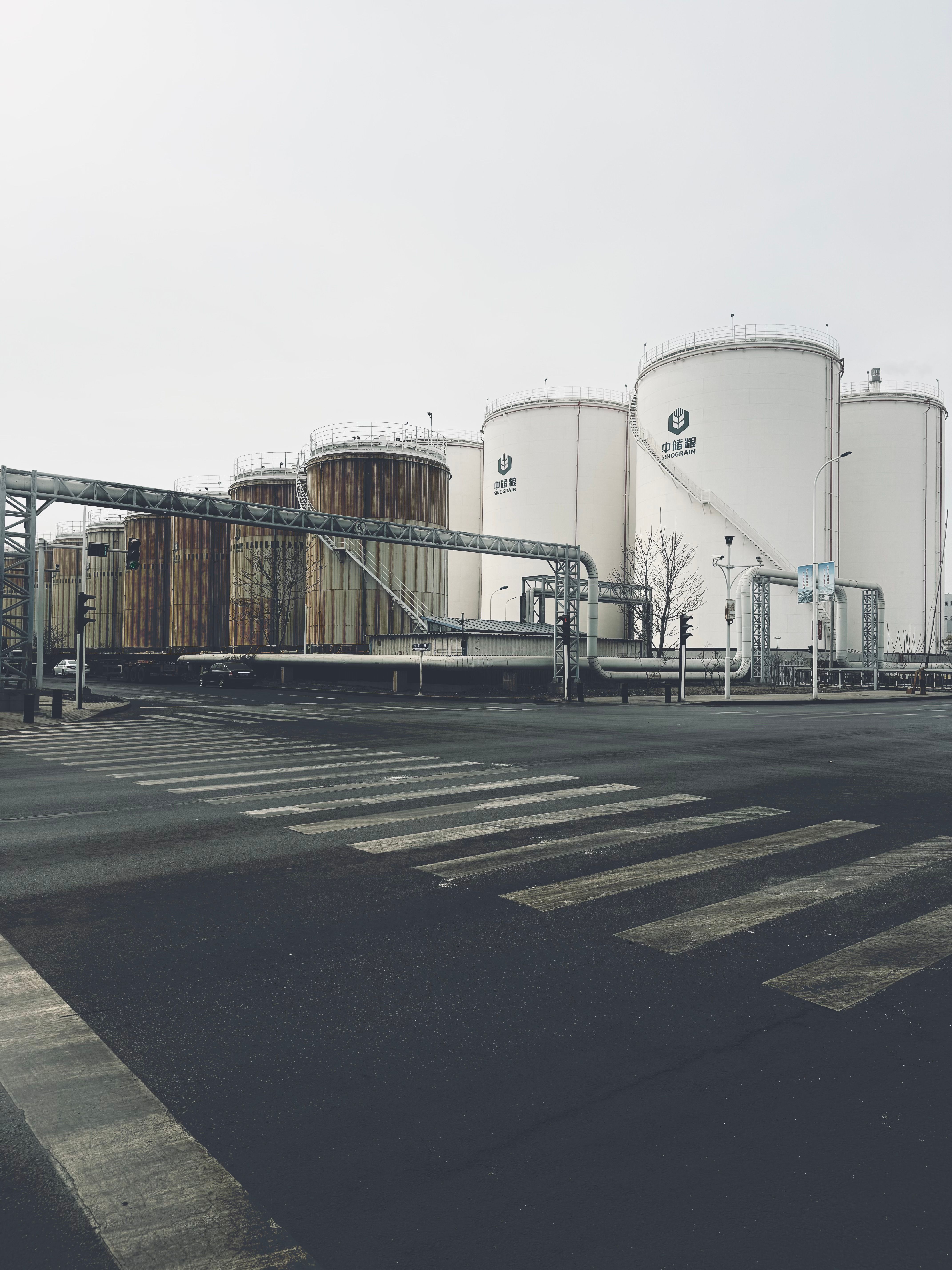 Factory Silos near Street · Free Stock Photo