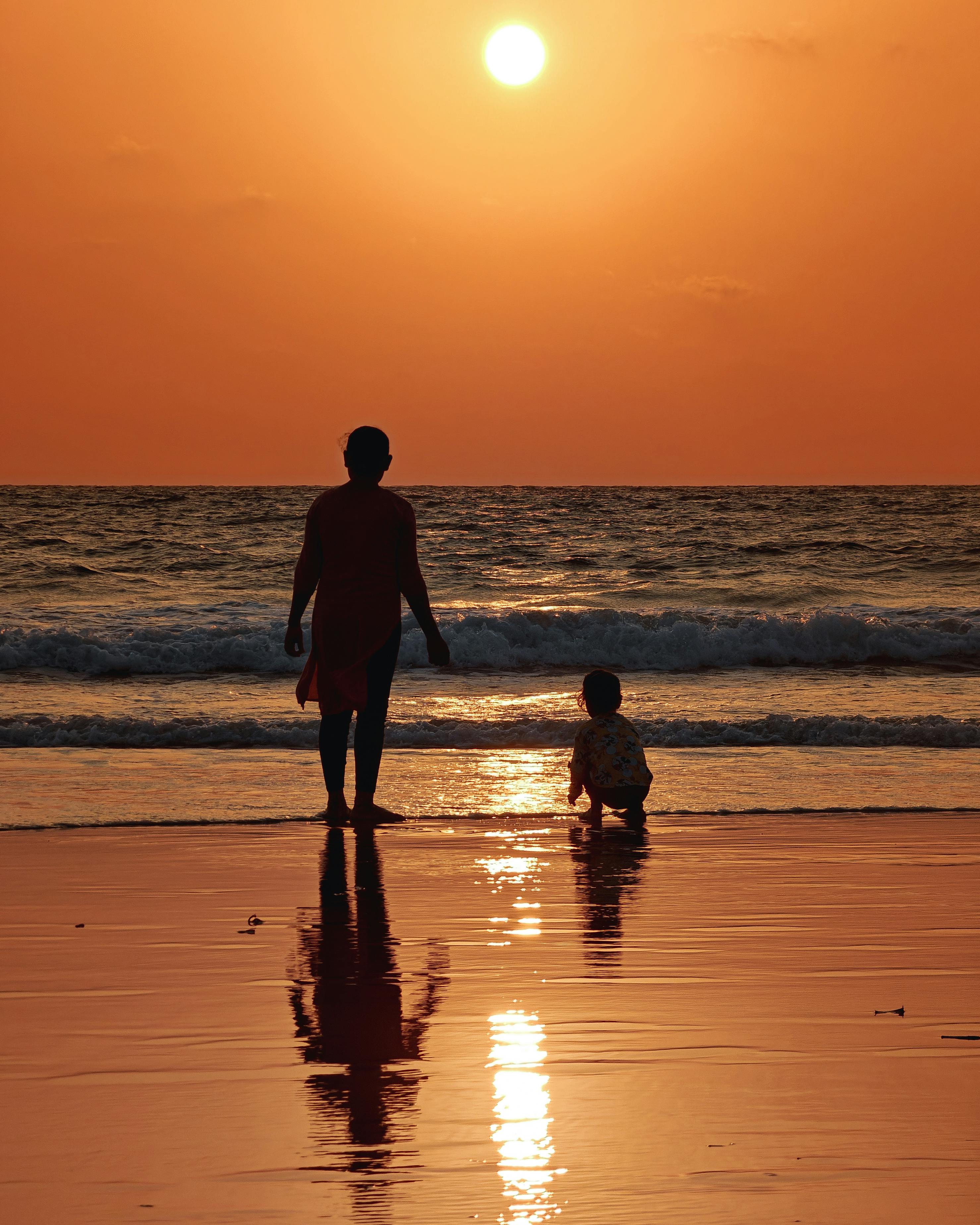 Family Enjoying Sunset at Goa Beach · Free Stock Photo