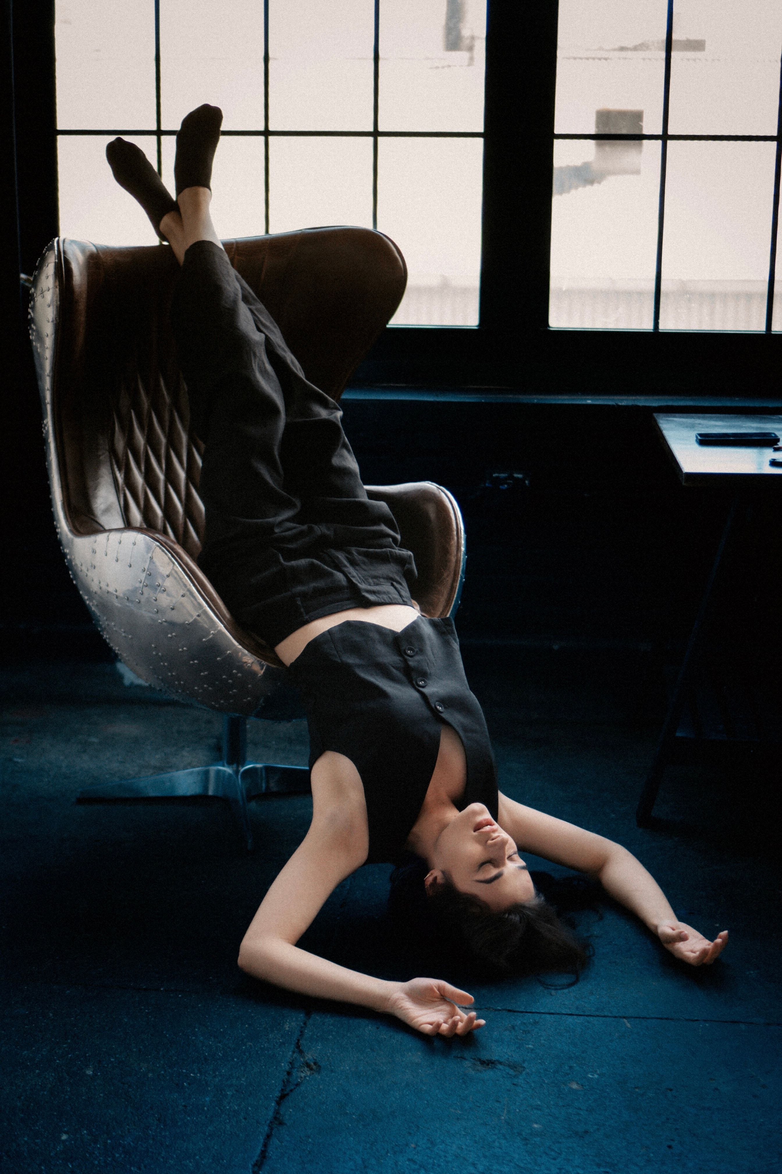 Woman Lying Upside Down on Armchair · Free Stock Photo