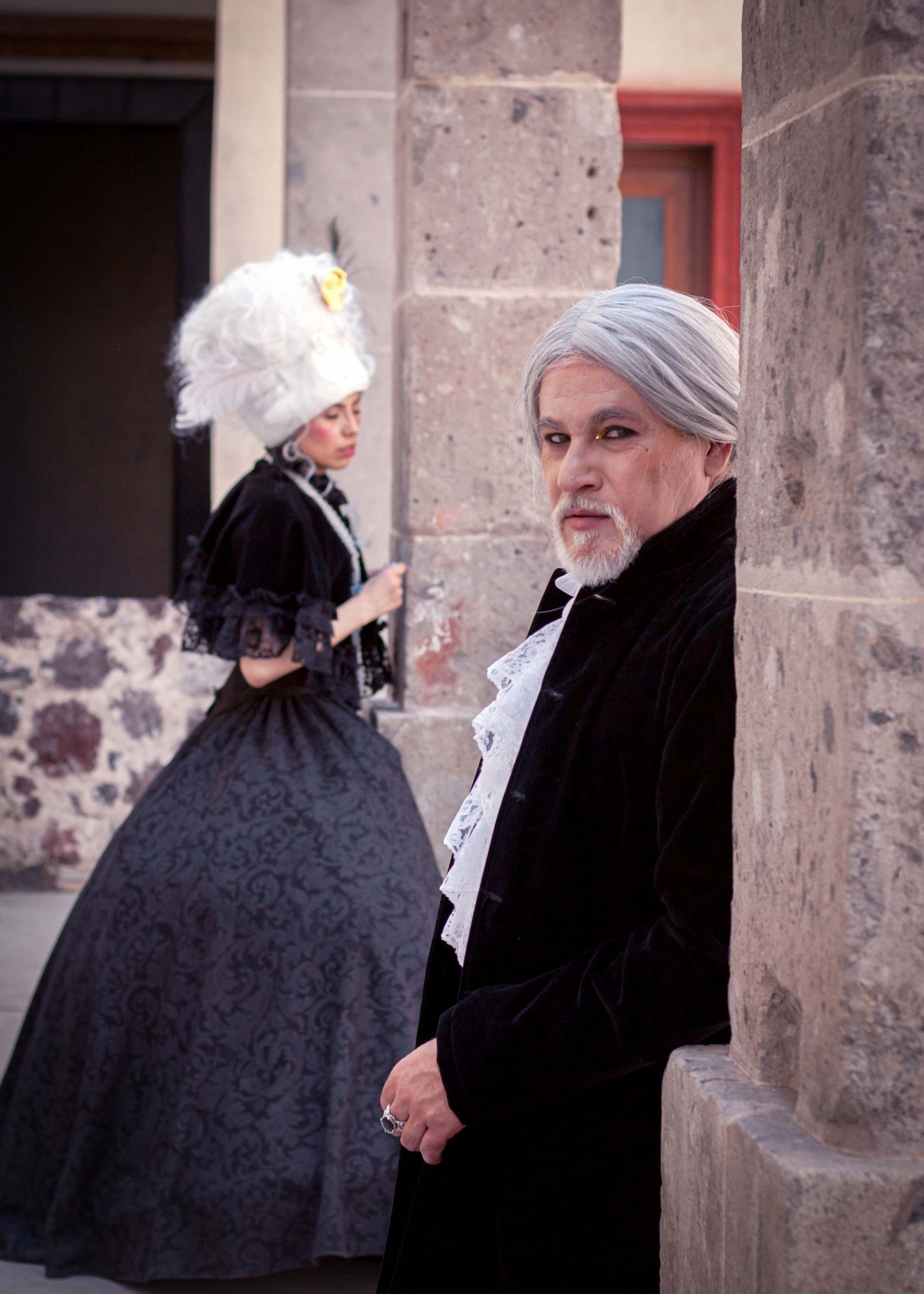 A man and woman in period costumes standing next to each other · Free ...