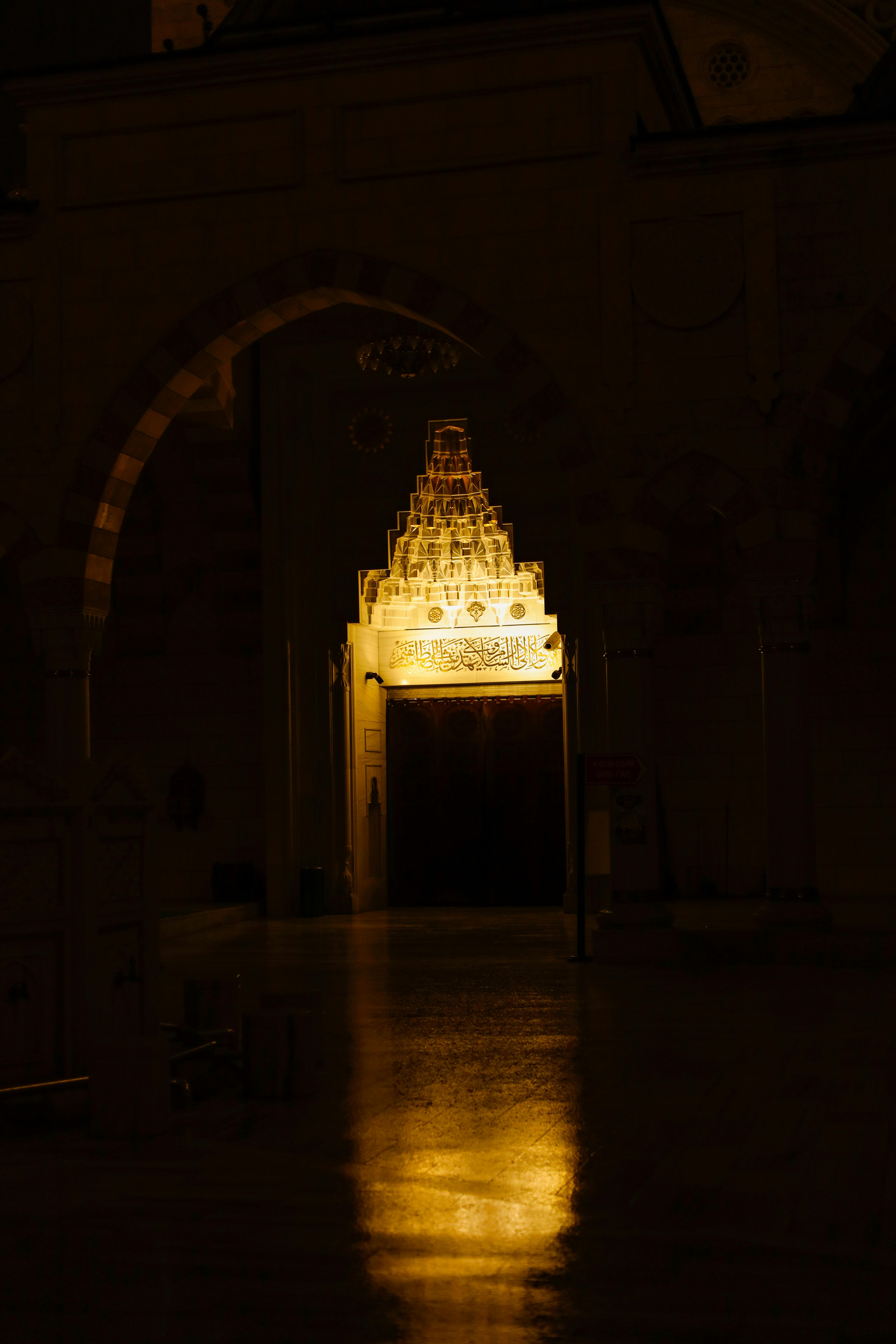 The entrance to a mosque at night with light · Free Stock Photo