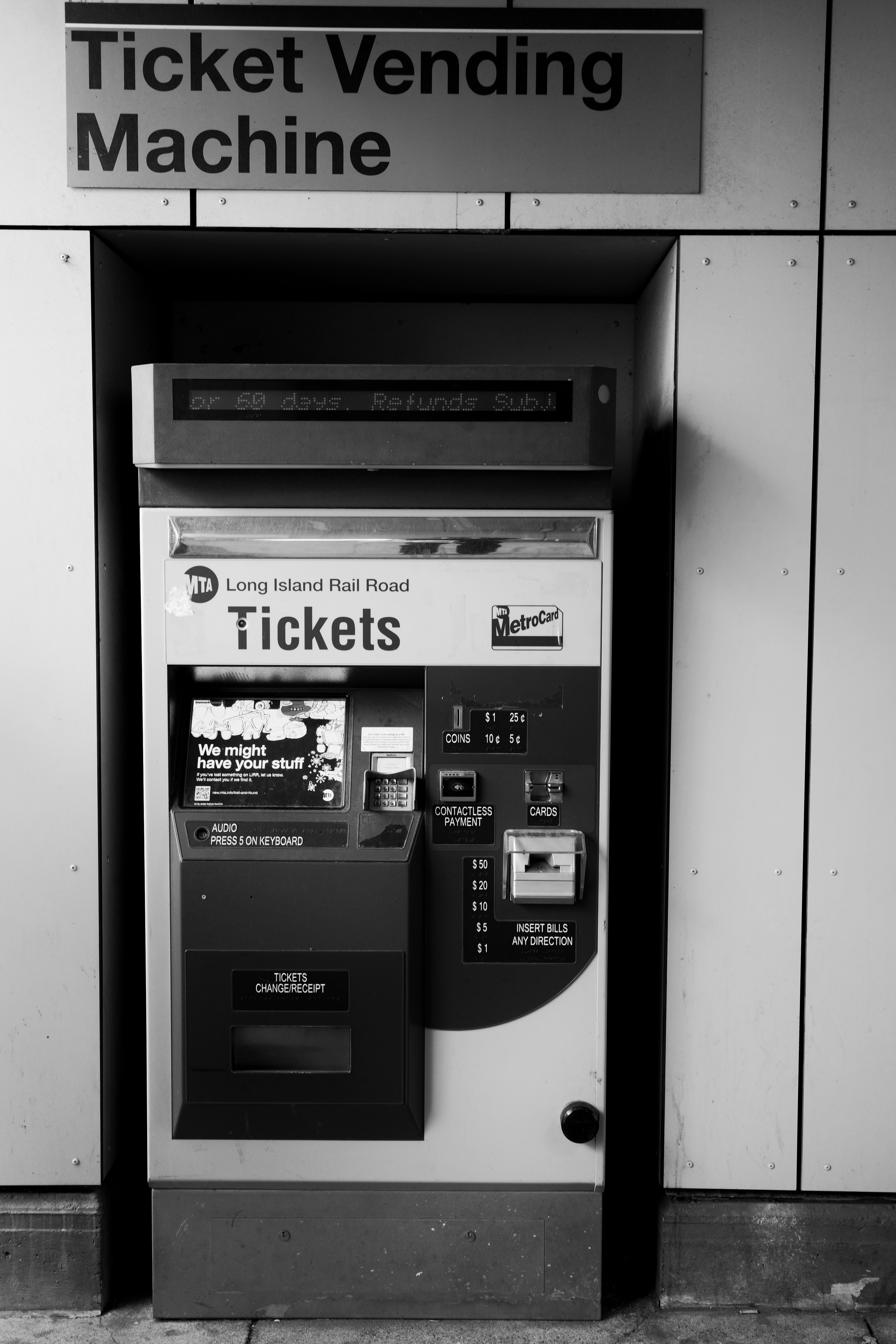 A black and white photo of a ticket vending machine · Free Stock Photo