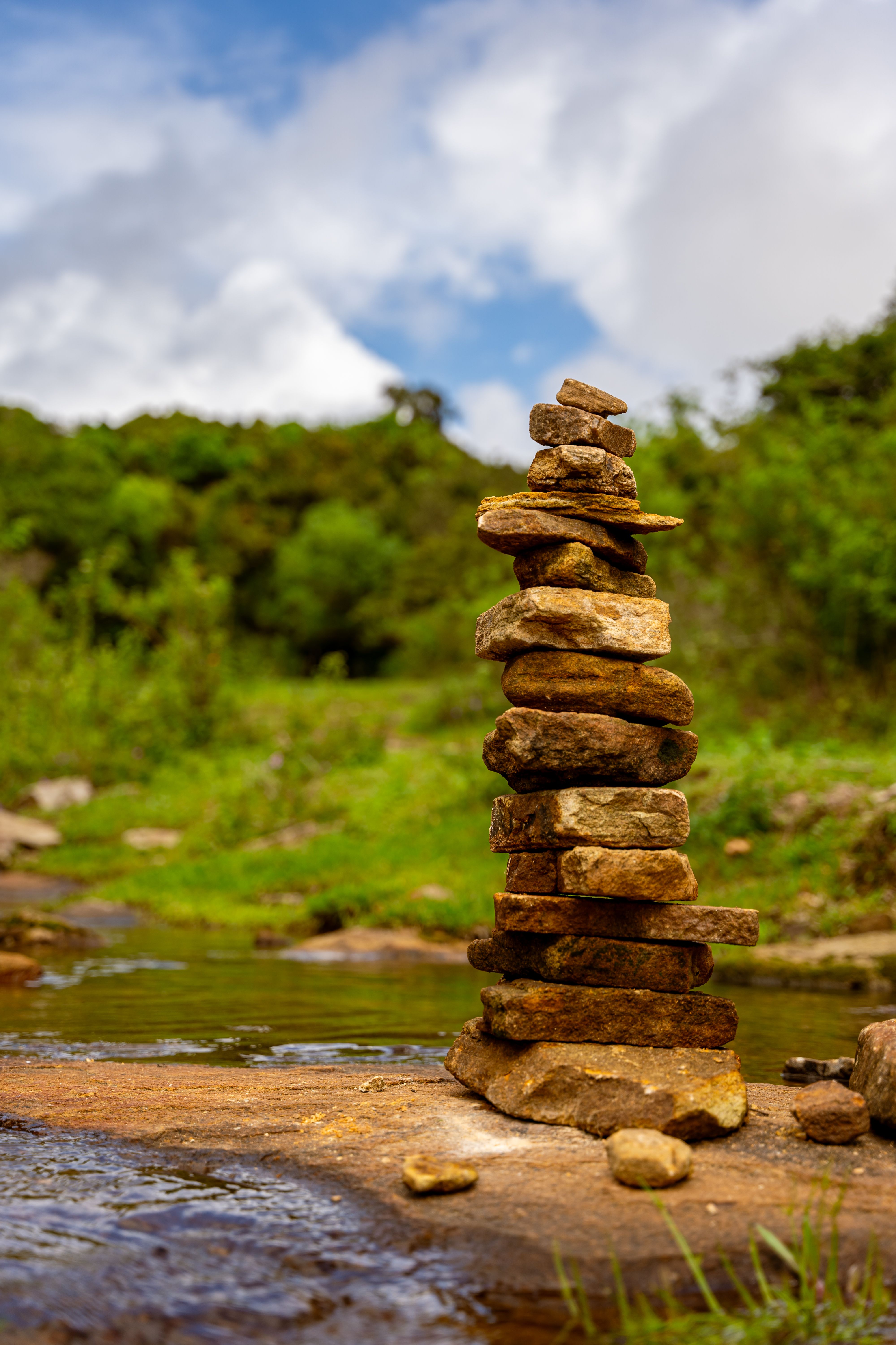 A stack of rocks in the middle of a river · Free Stock Photo