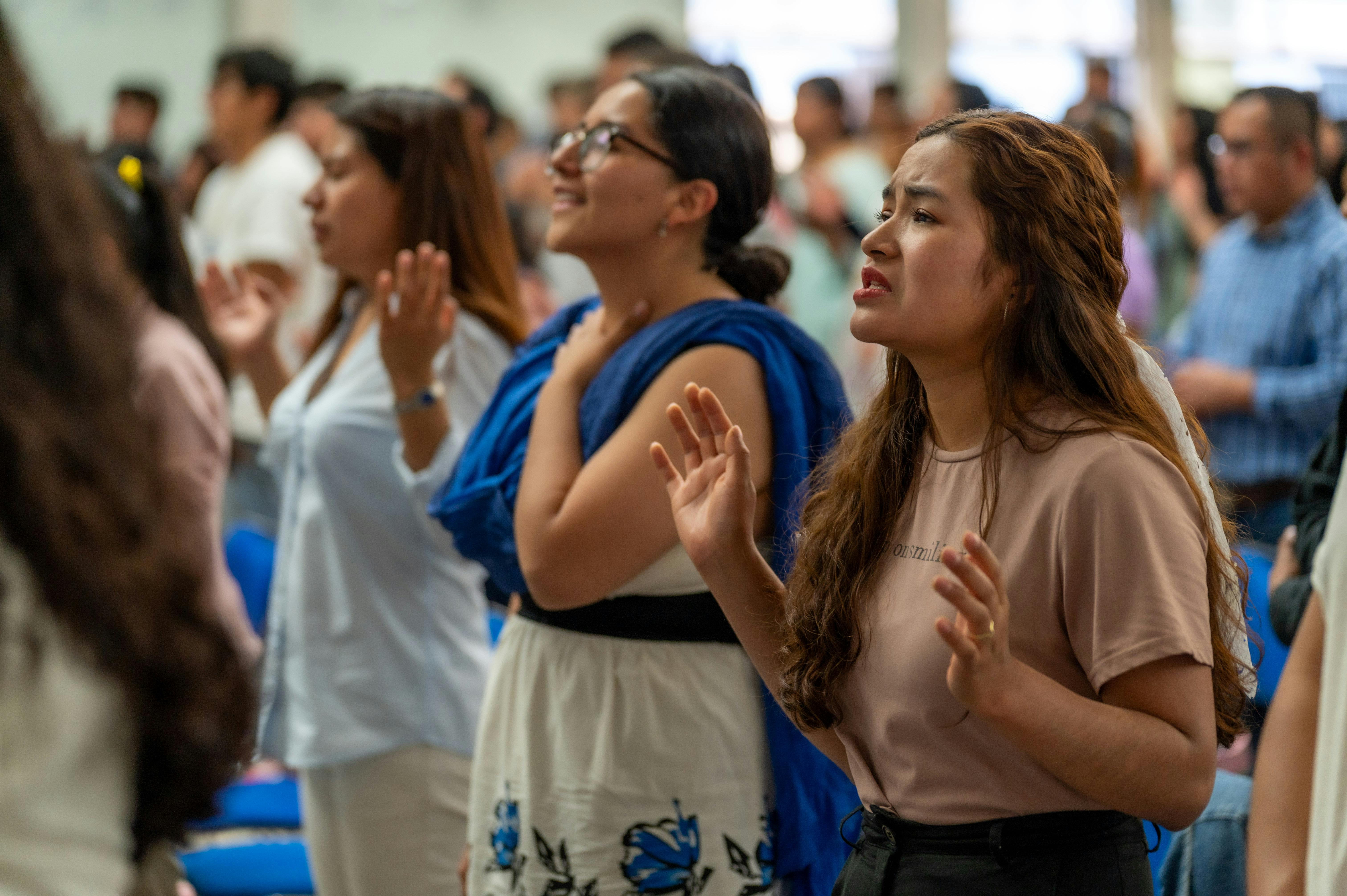 Women Standing at Gathering and Praying · Free Stock Photo