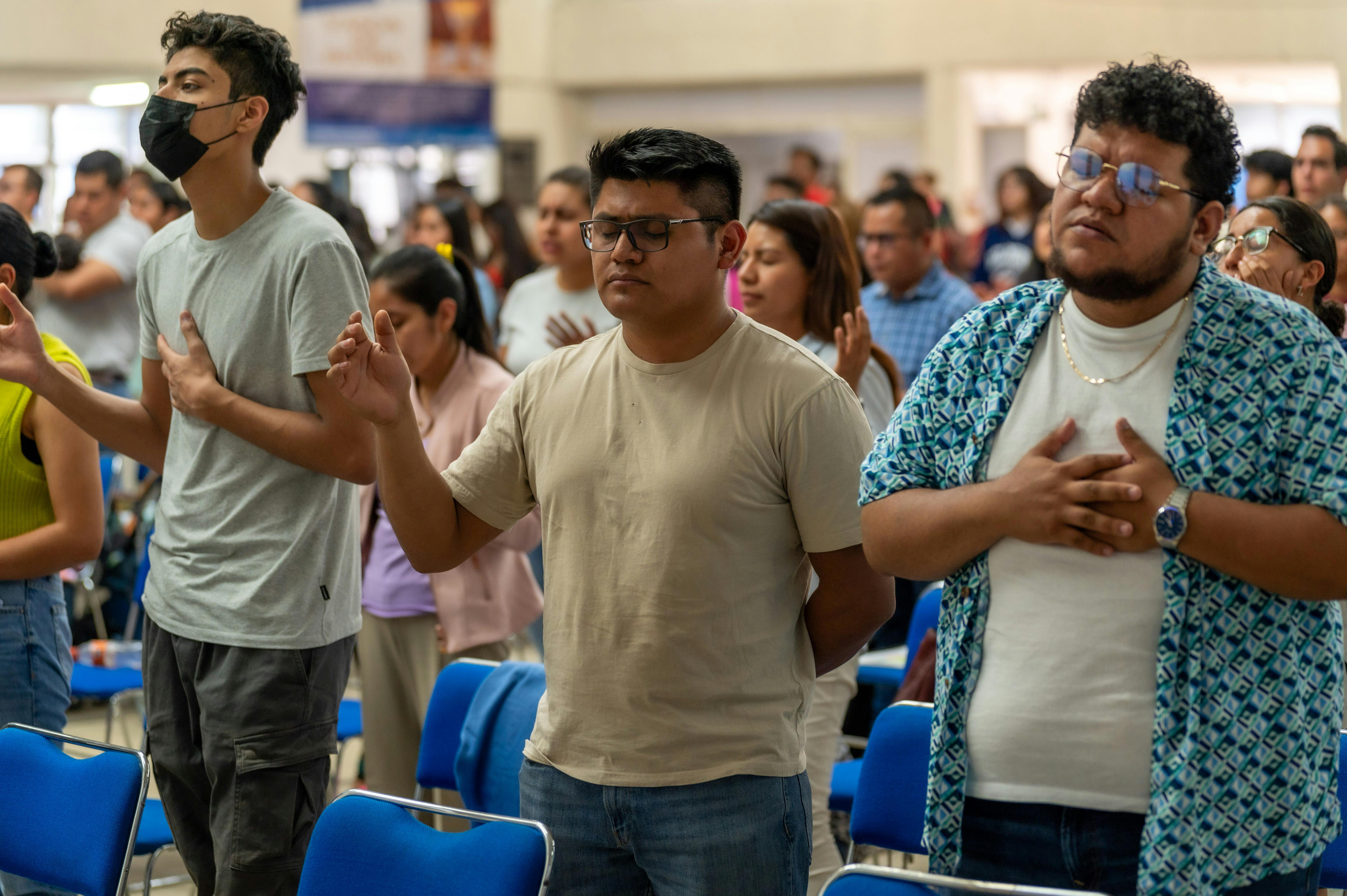 Men Praying during Service · Free Stock Photo