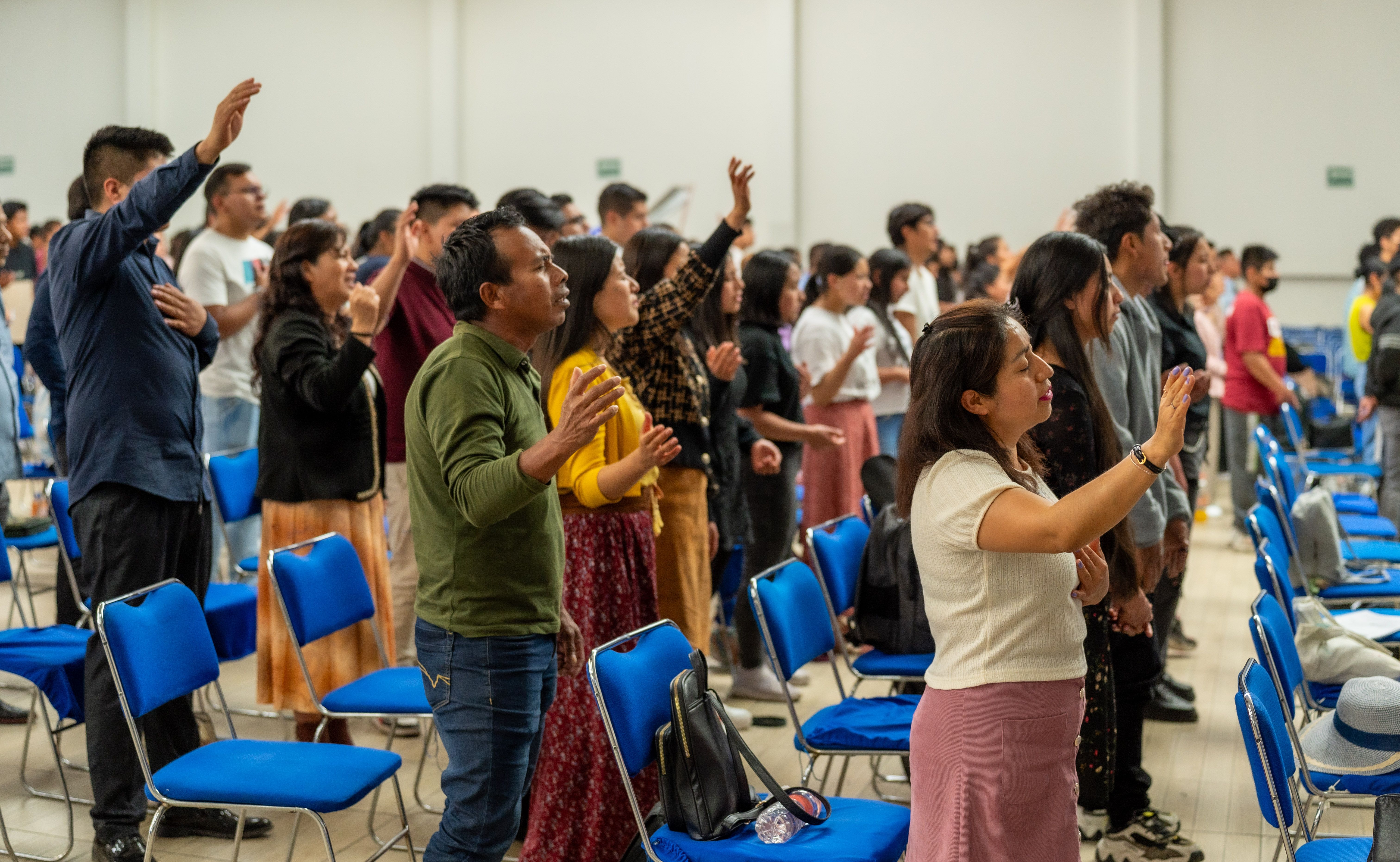 People Standing with Eyes Closed at Gathering and Praying · Free Stock ...