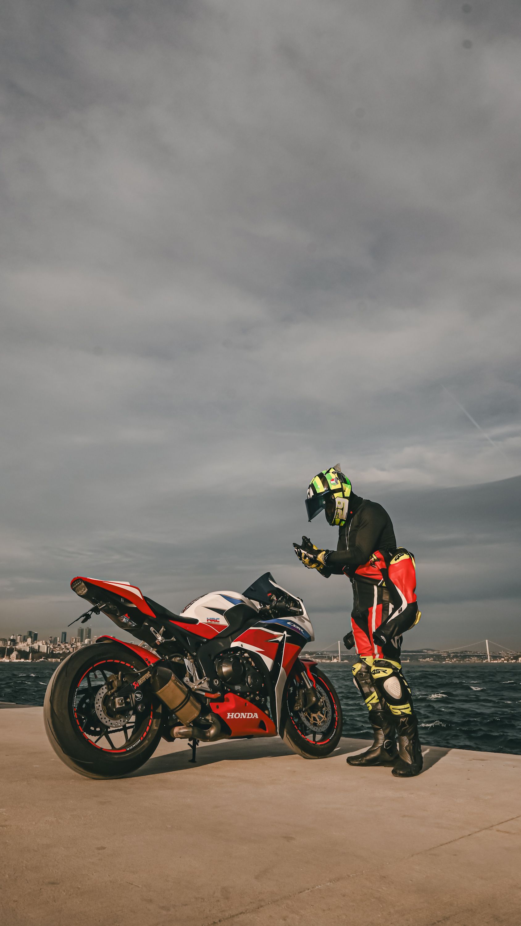 Biker by Racing Motorcycle · Free Stock Photo