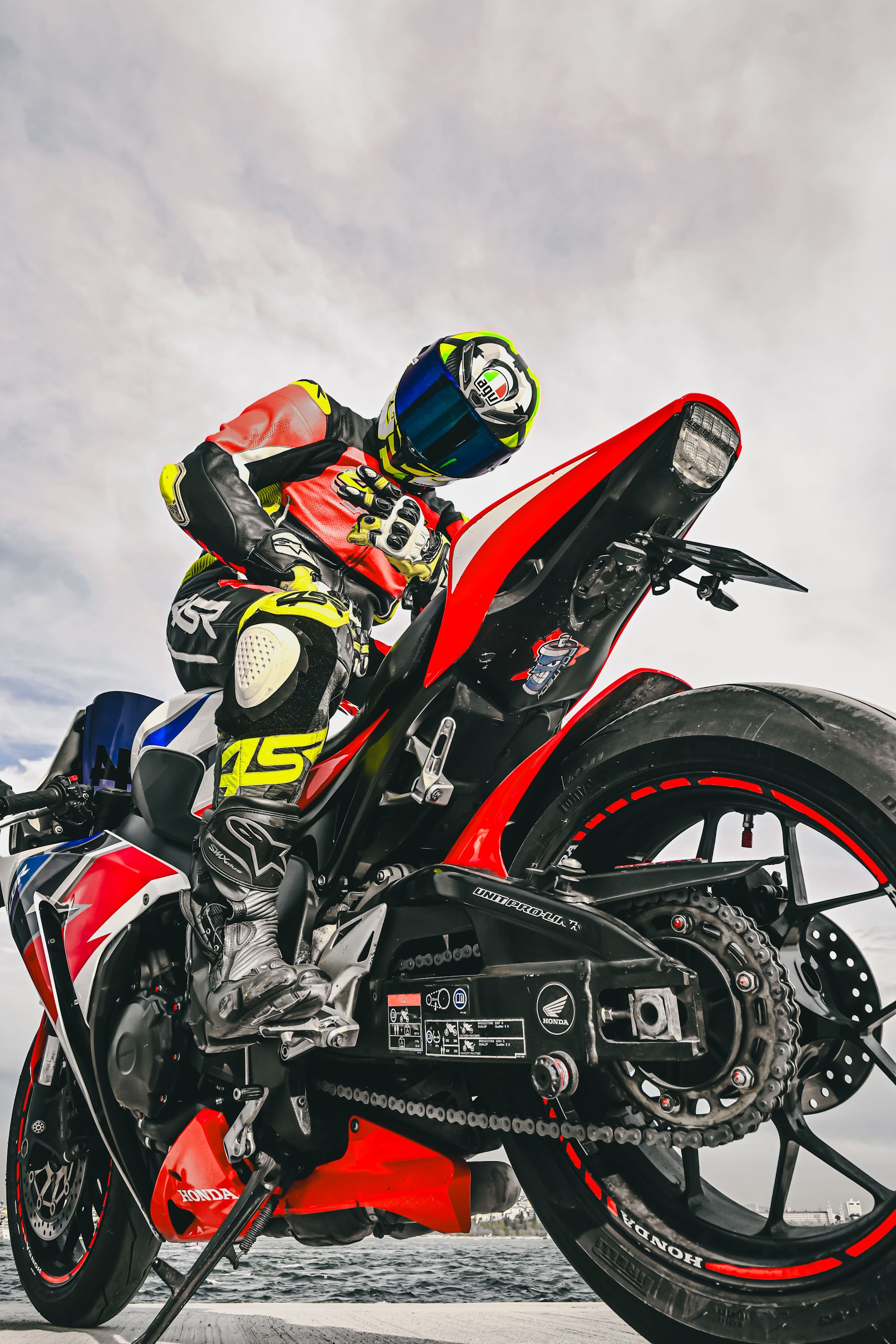 A person on a motorcycle is leaning on the bike · Free Stock Photo