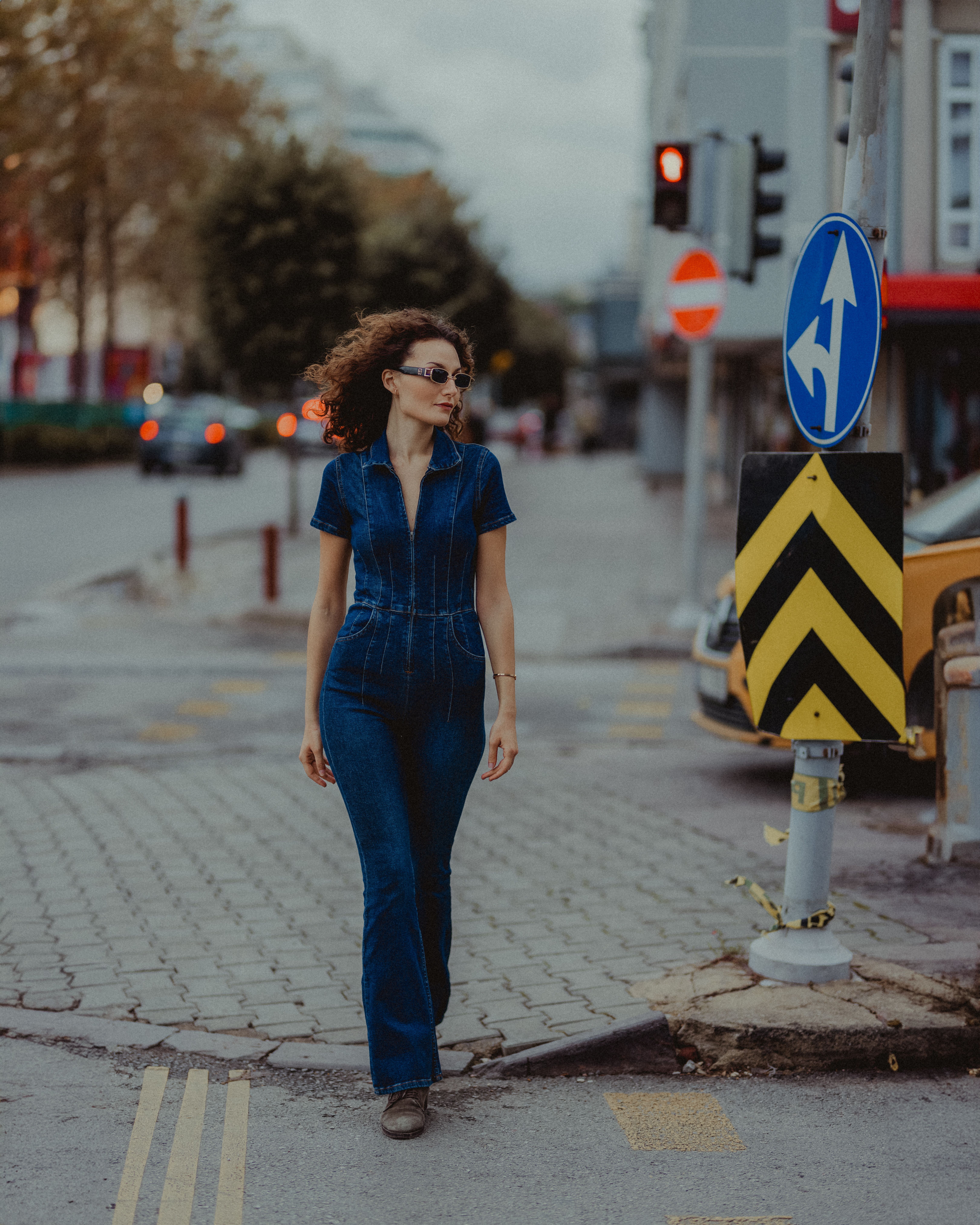 Woman in Jean Shirt and Jeans Crossing Street · Free Stock Photo