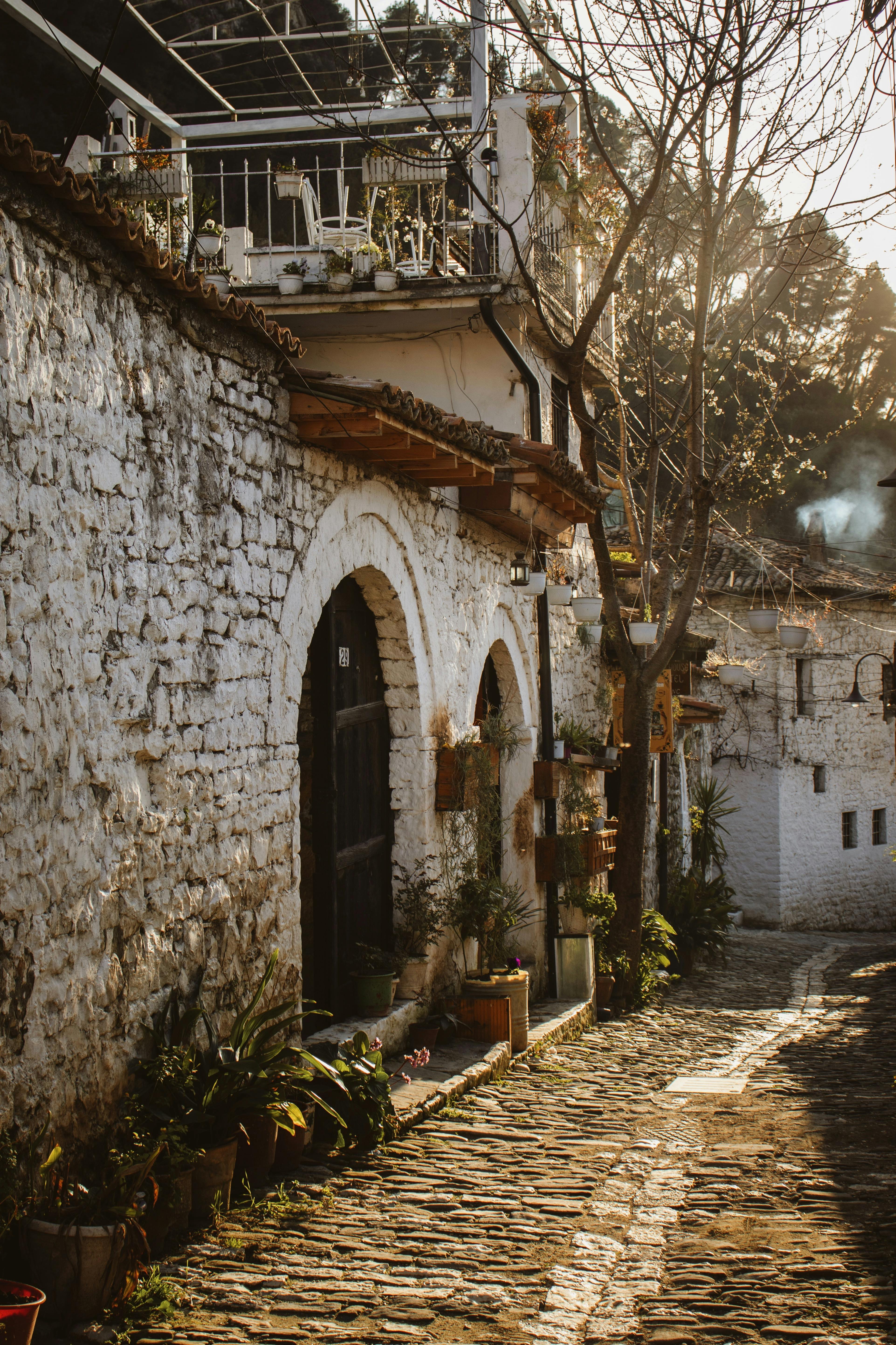 Vintage Building on Cobblestone Street in Town · Free Stock Photo