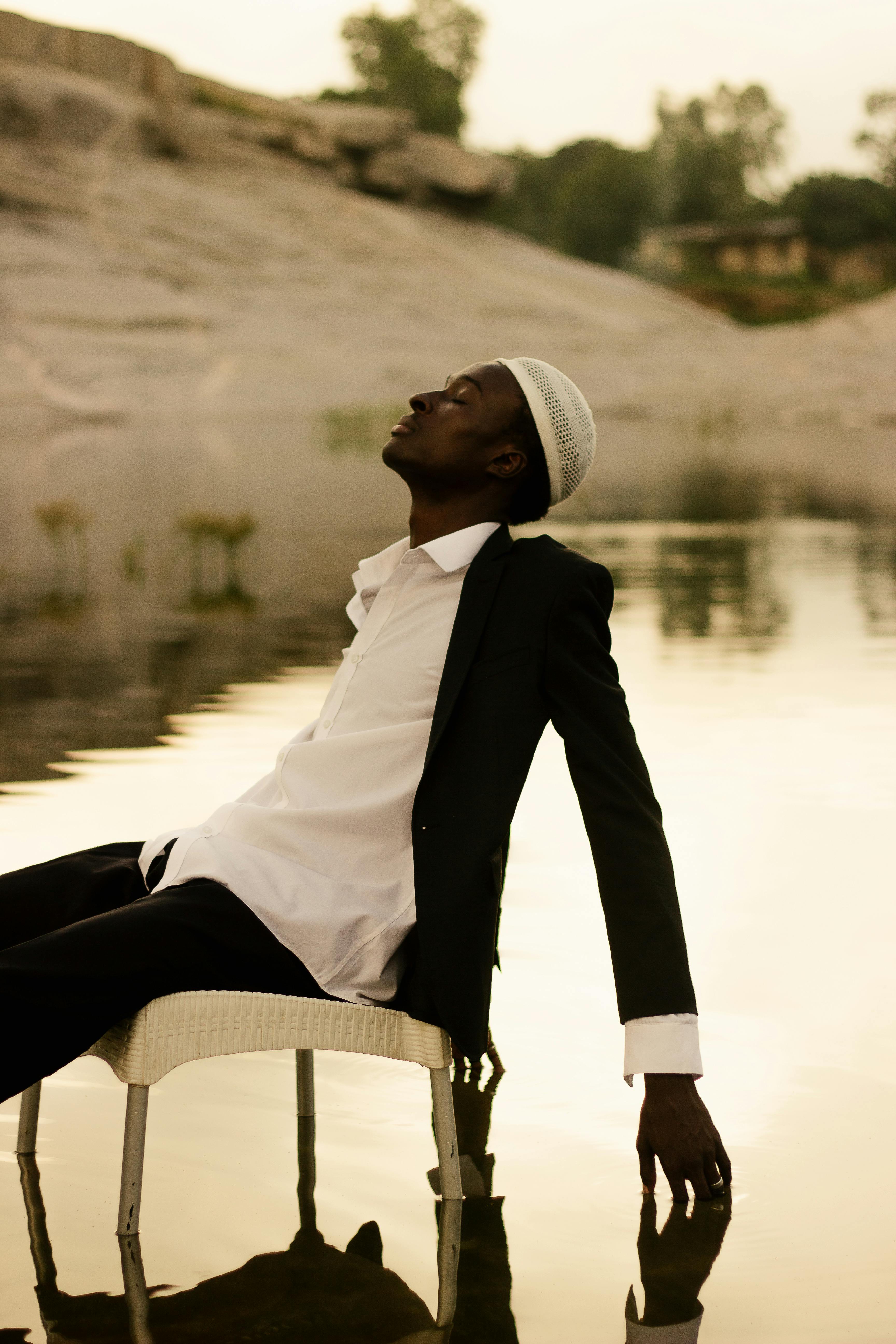 Man in Suit Standing in Lake · Free Stock Photo