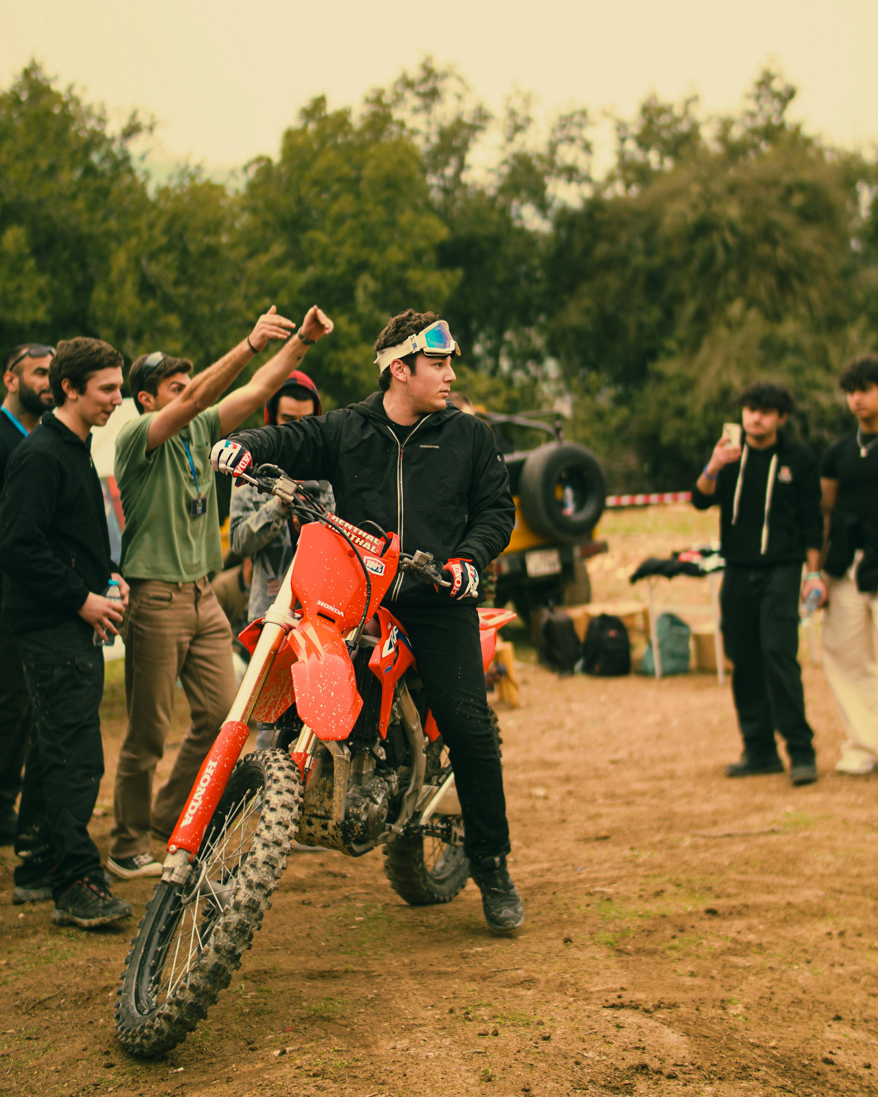 Men around Rider on Motocross on Dirt Track · Free Stock Photo