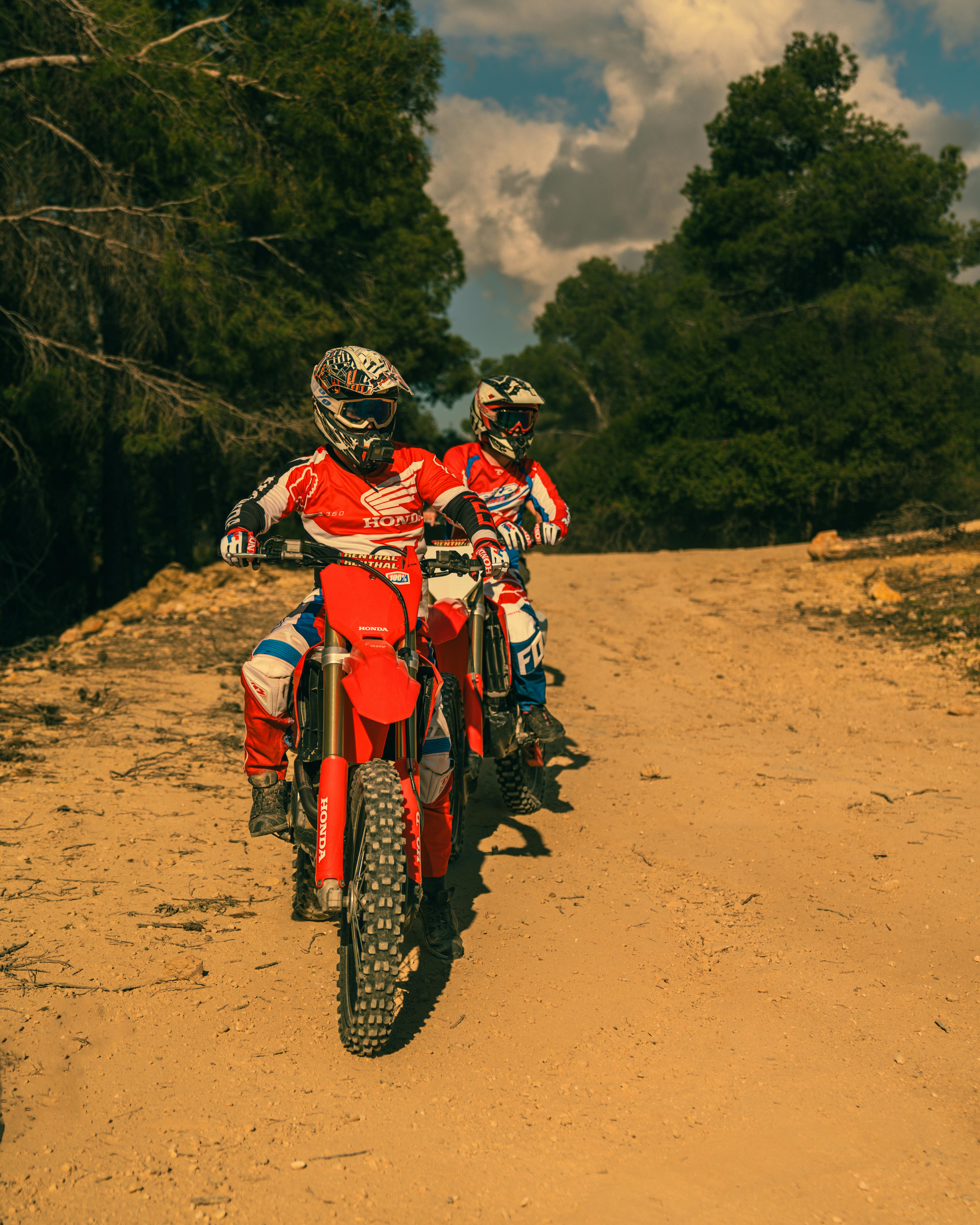 People Riding on Dirt Bikes in a Competition · Free Stock Photo